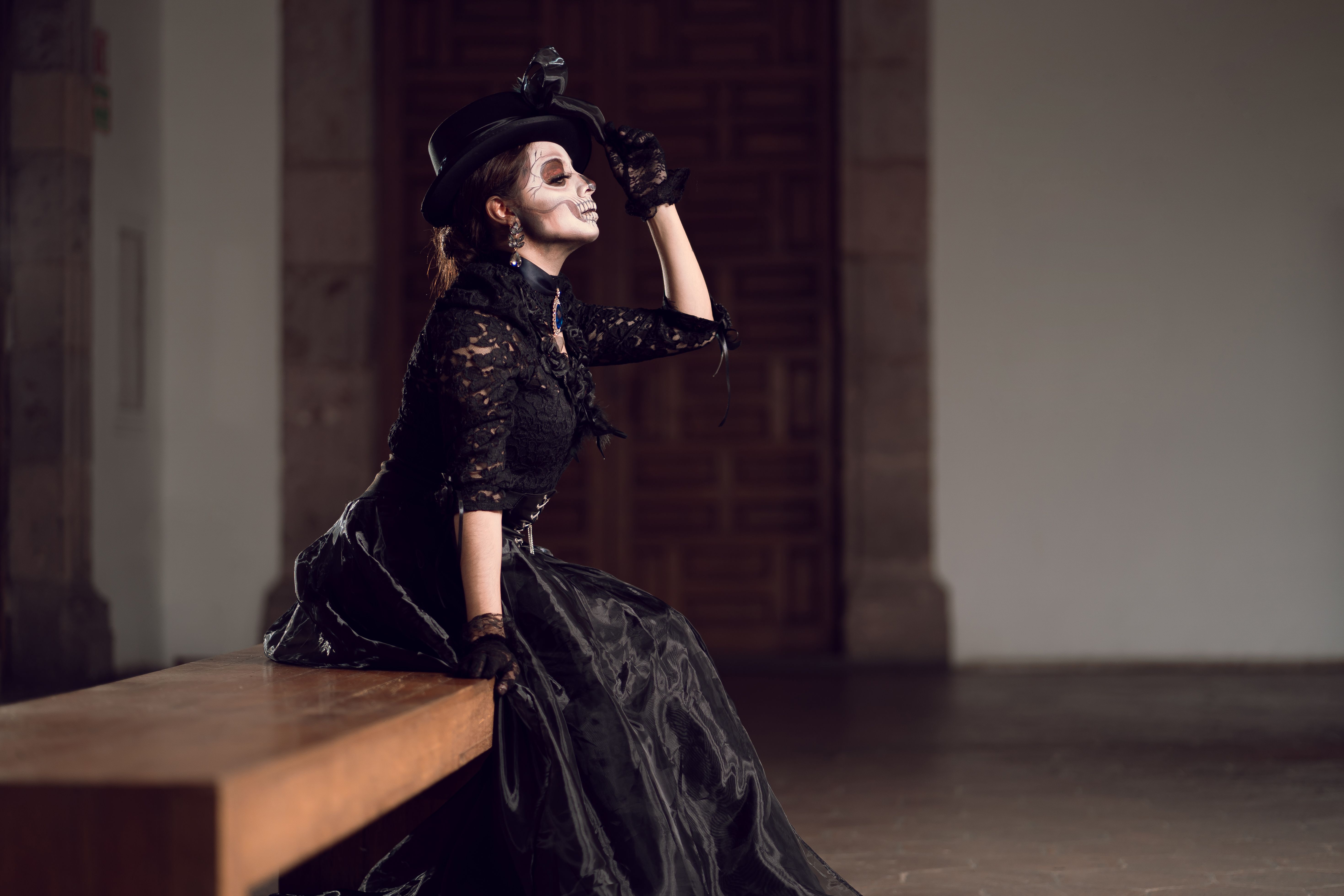 Catrina Sitting in Dress and Hat · Free Stock Photo