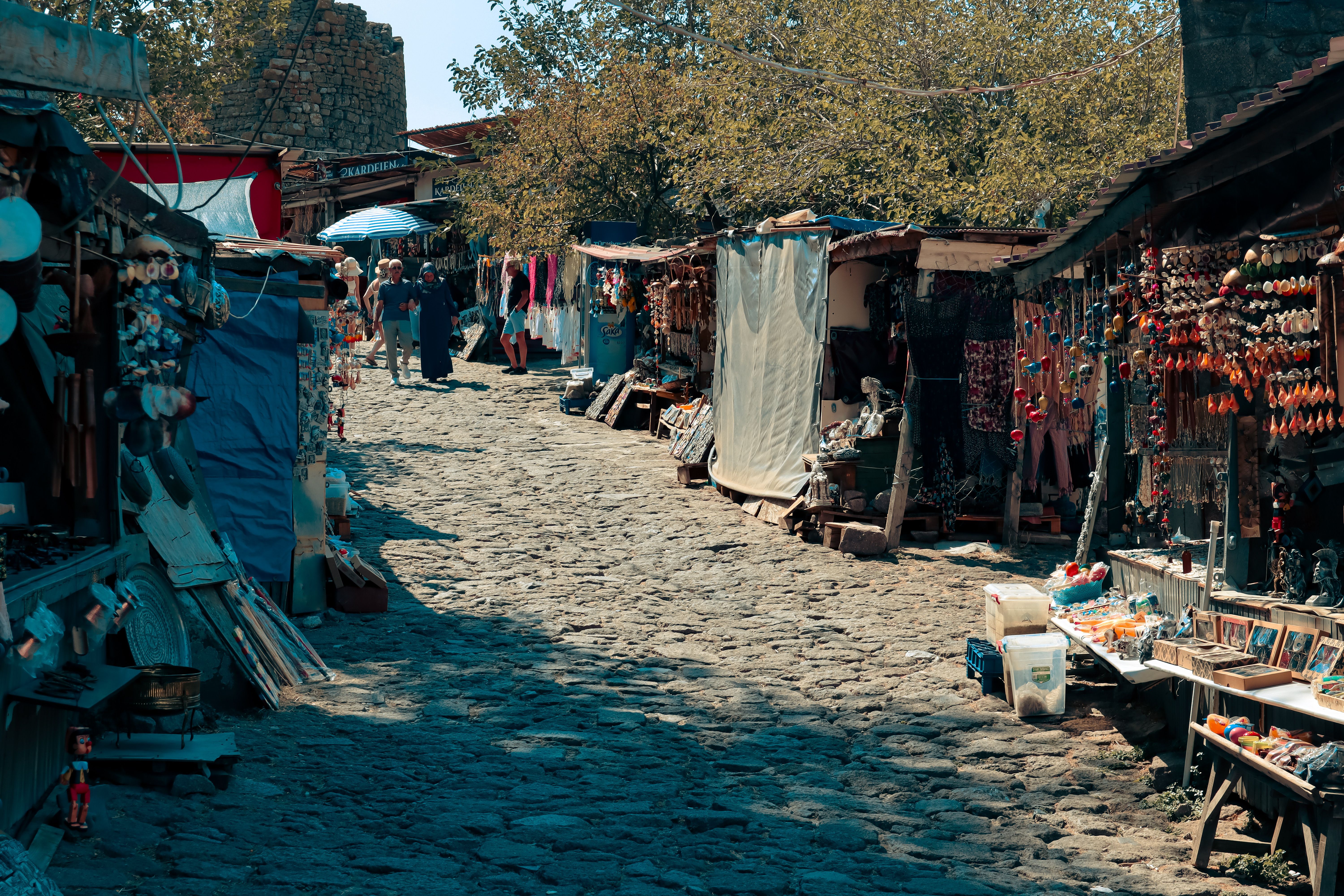 A street with many vendors selling their goods · Free Stock Photo