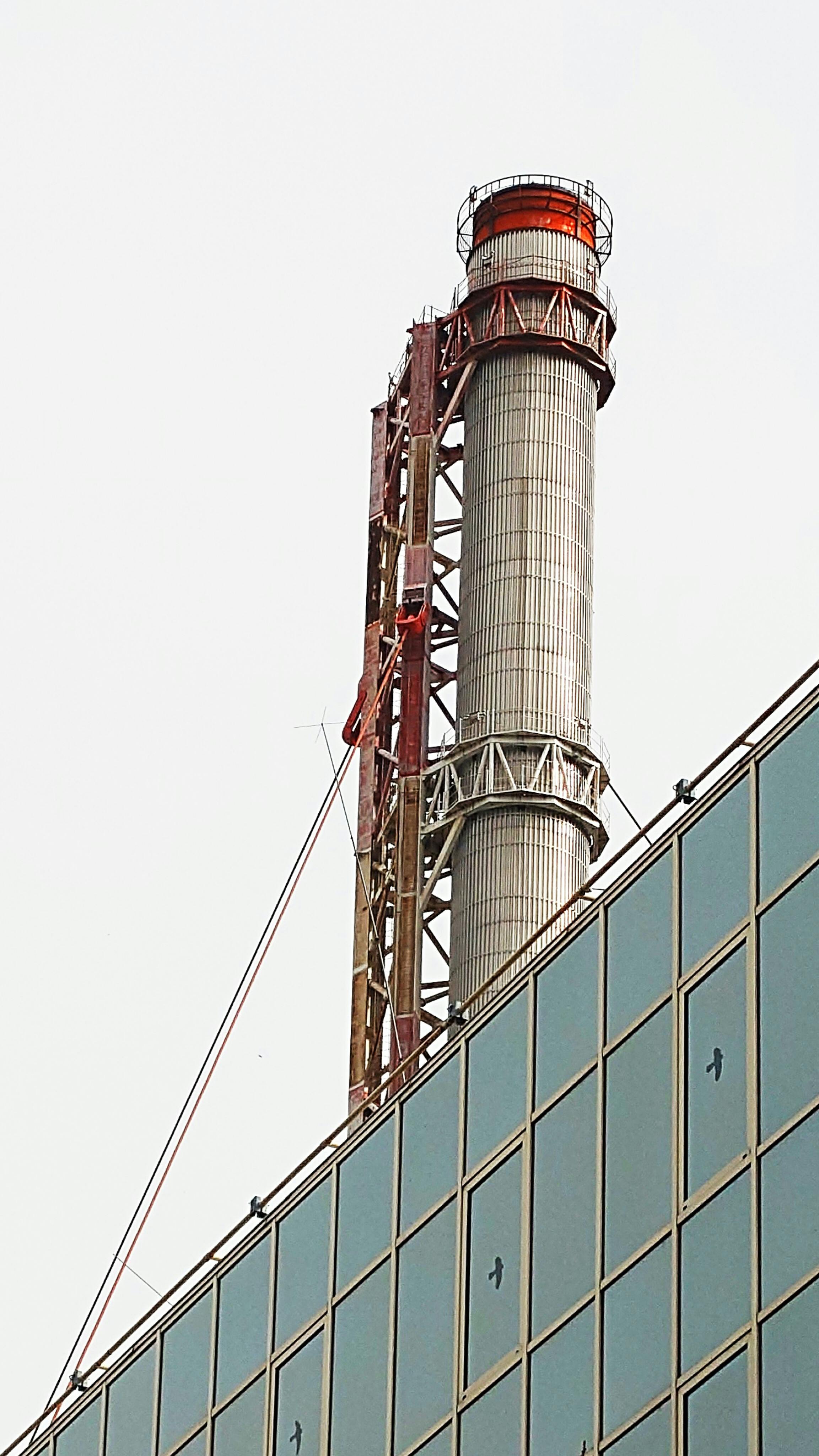 Chimney over Factory Wall · Free Stock Photo