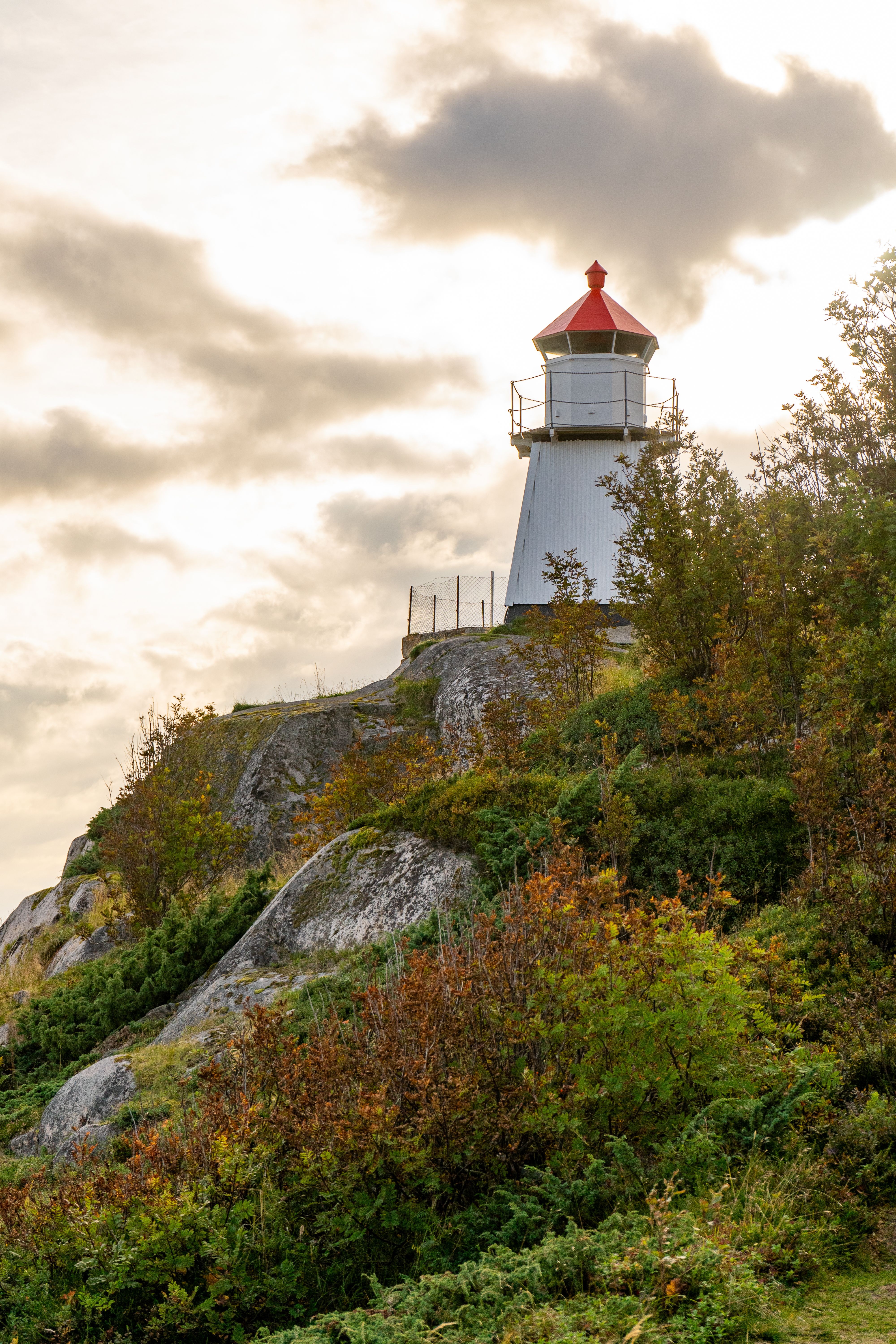 Lighthouse on Rocky Cliff · Free Stock Photo