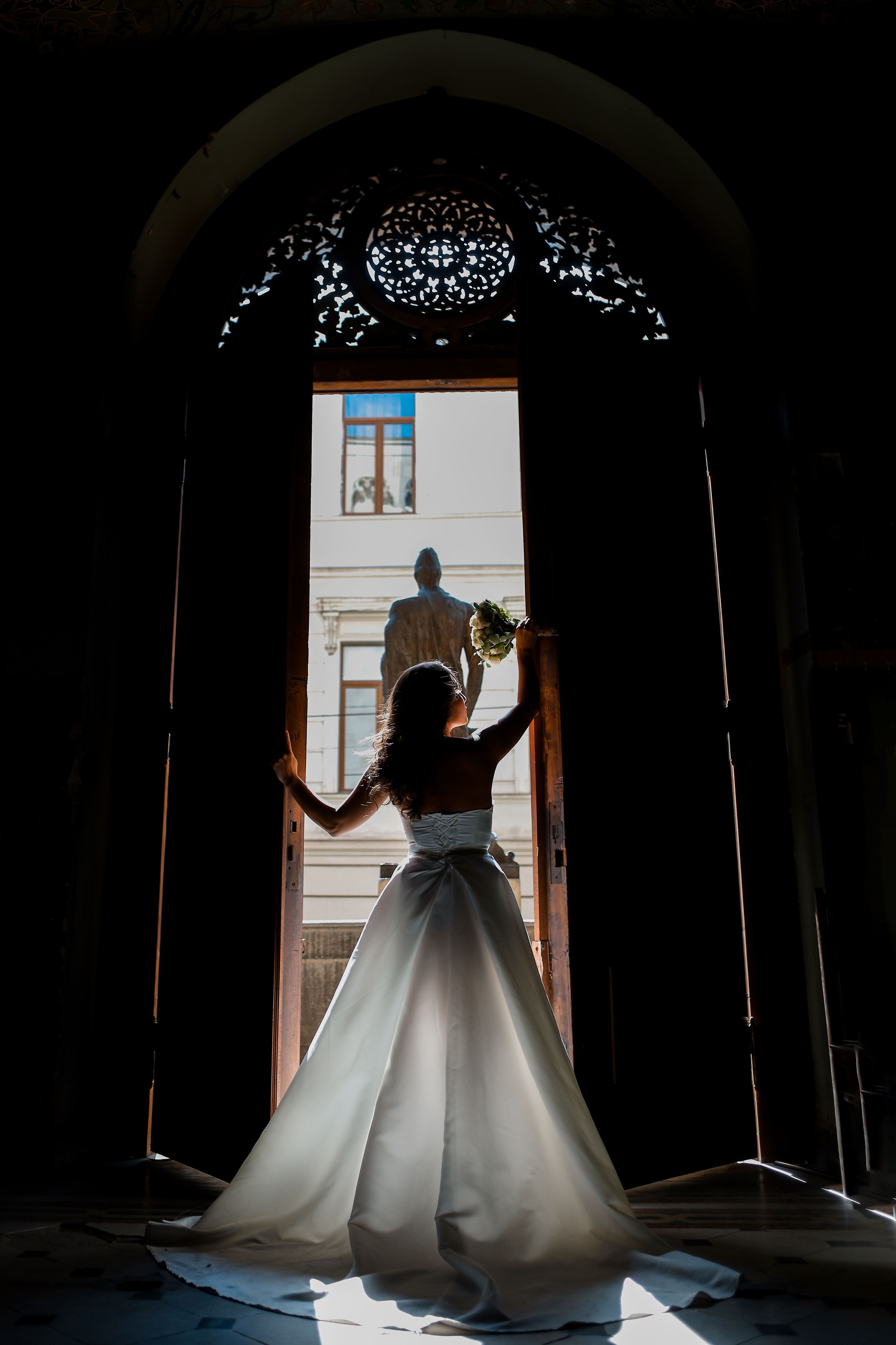 The Bride Standing Inside a Building with Mosaics · Free Stock Photo