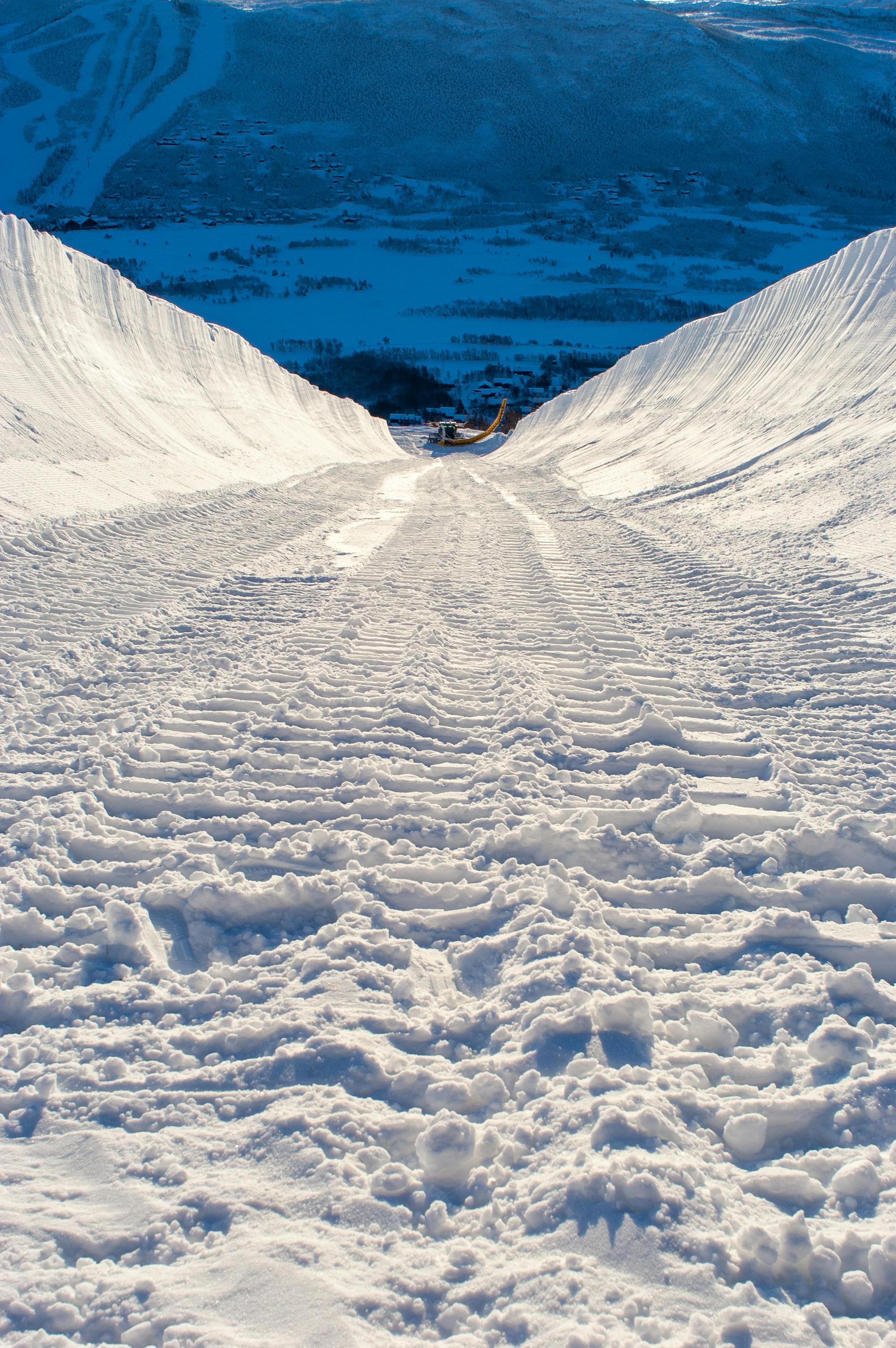 Snow-Covered Halfpipe with Mountain Backdrop in Norway · Free Stock Photo