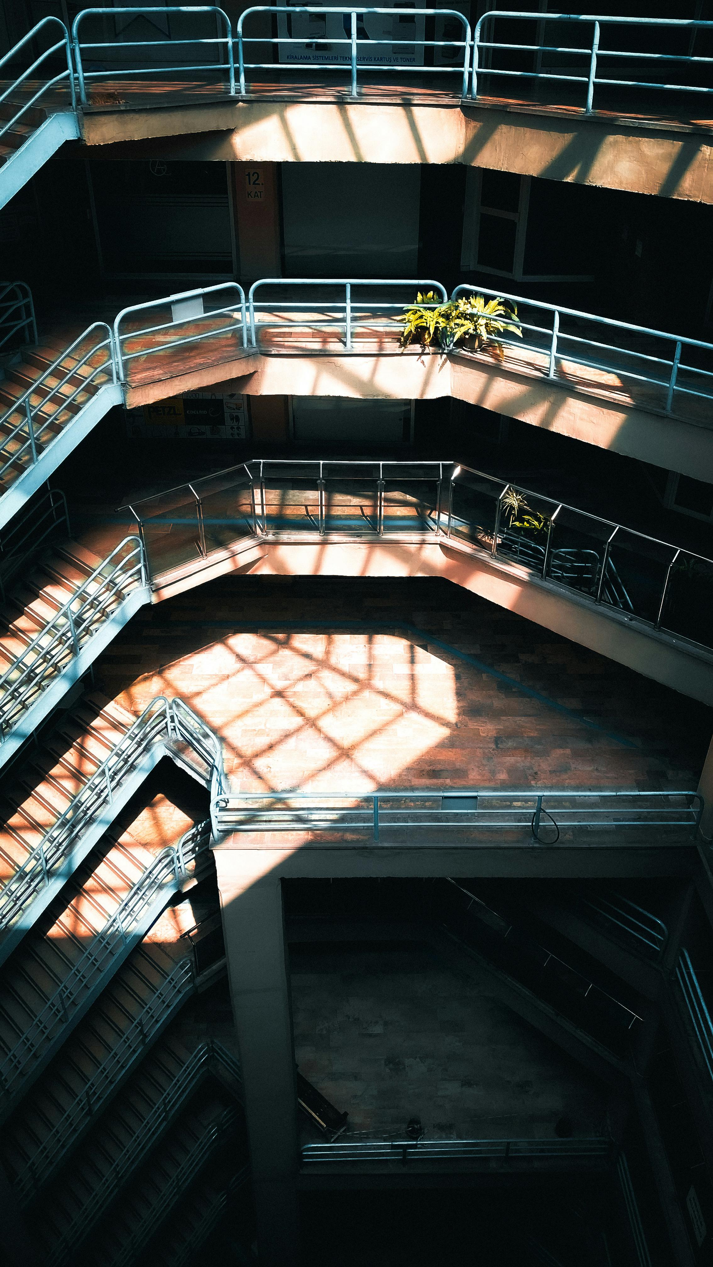 Modern Atrium with Geometric Sunlight Patterns · Free Stock Photo