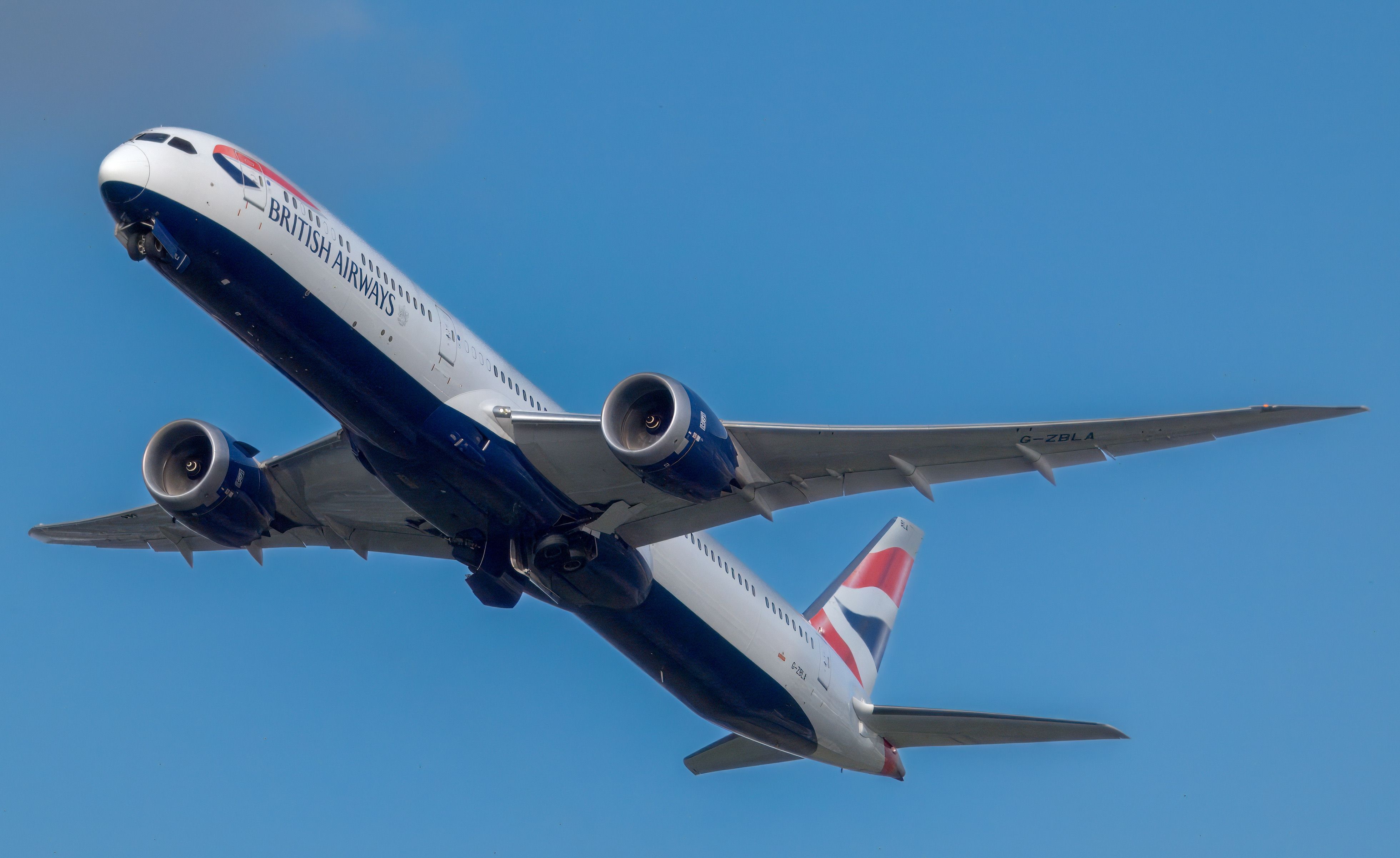 British Airways Plane Flying Against Blue Sky · Free Stock Photo