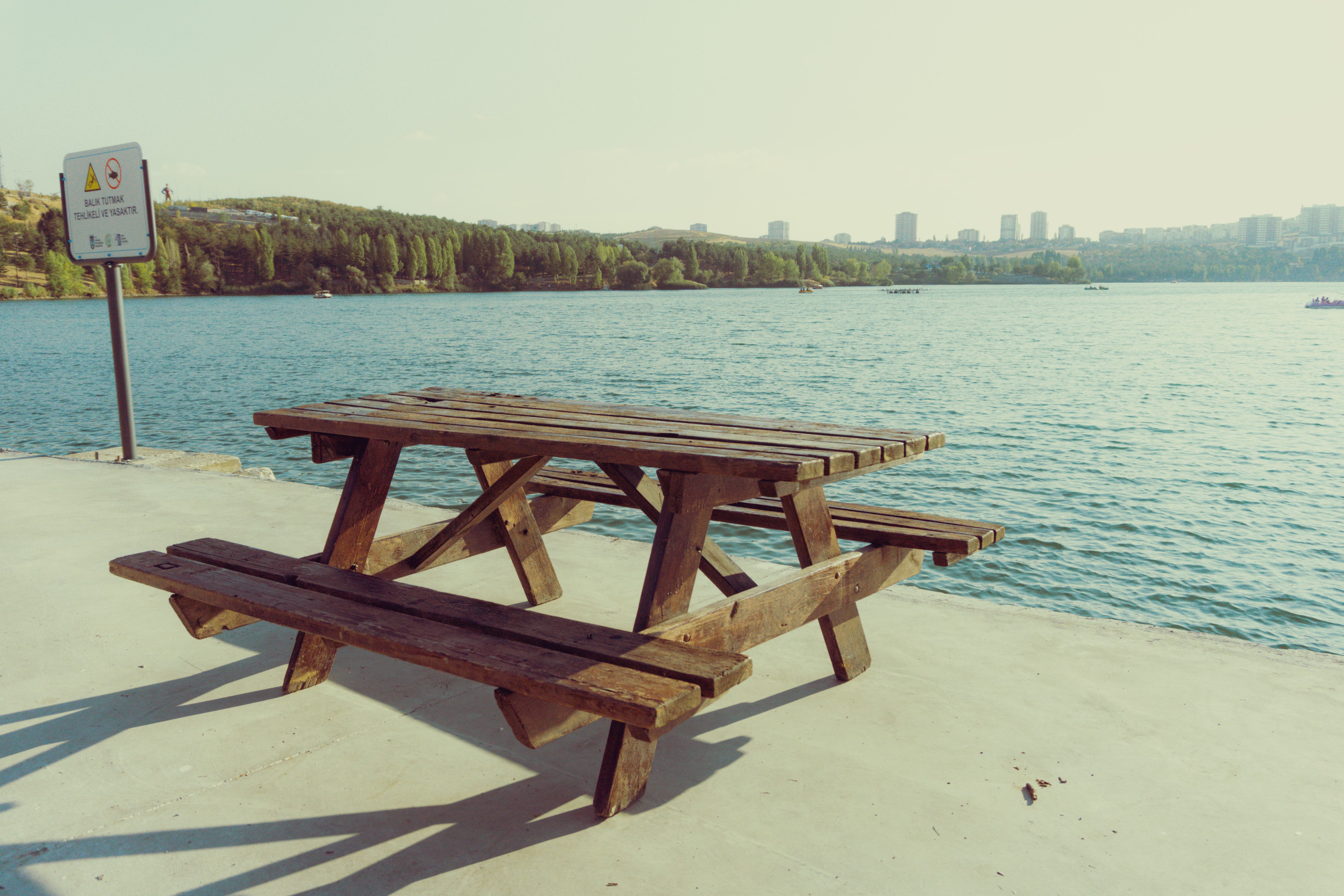 Picnic Wooden Table with Bench on Promenade · Free Stock Photo