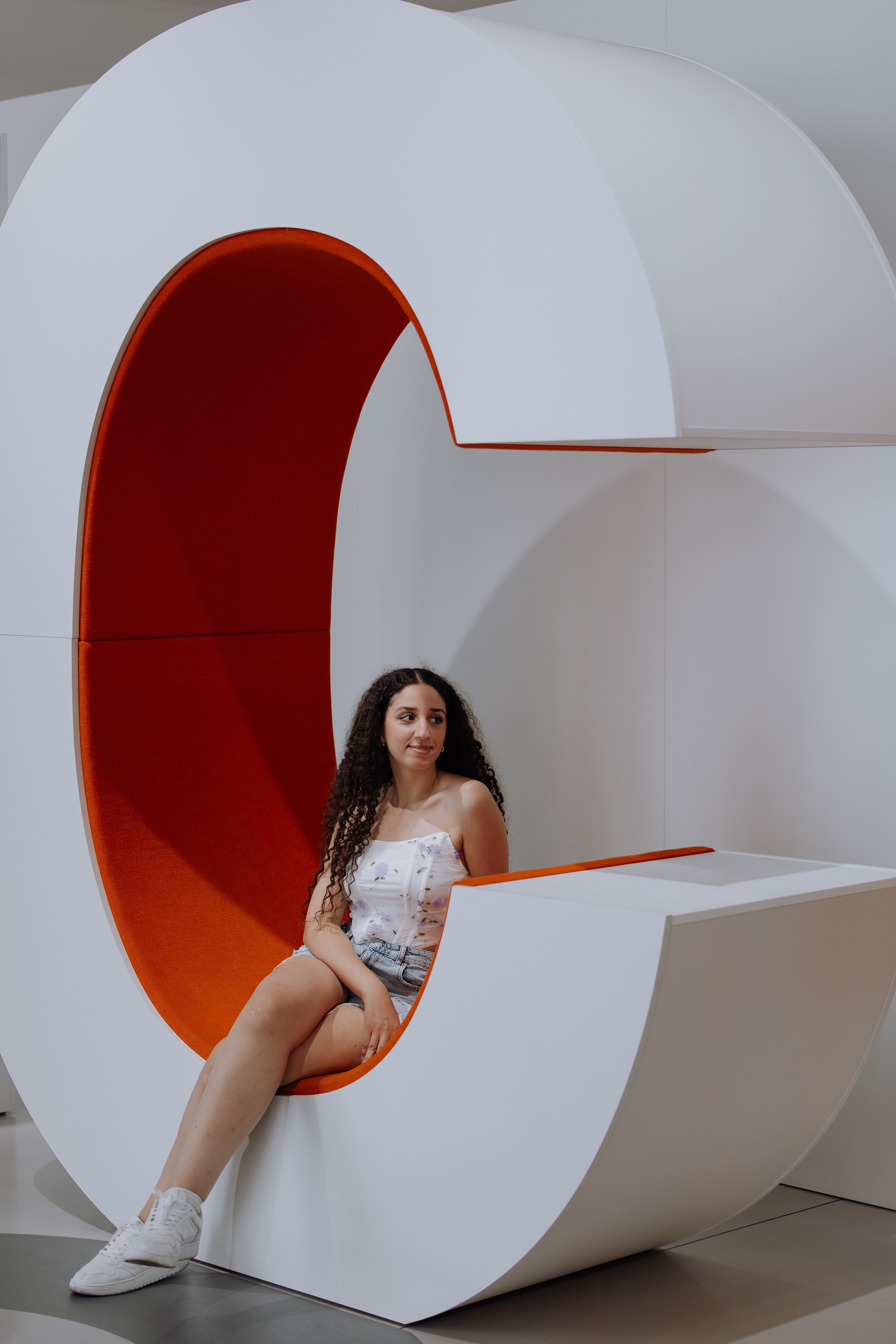 Woman Sitting in Letter C Shaped Seat · Free Stock Photo