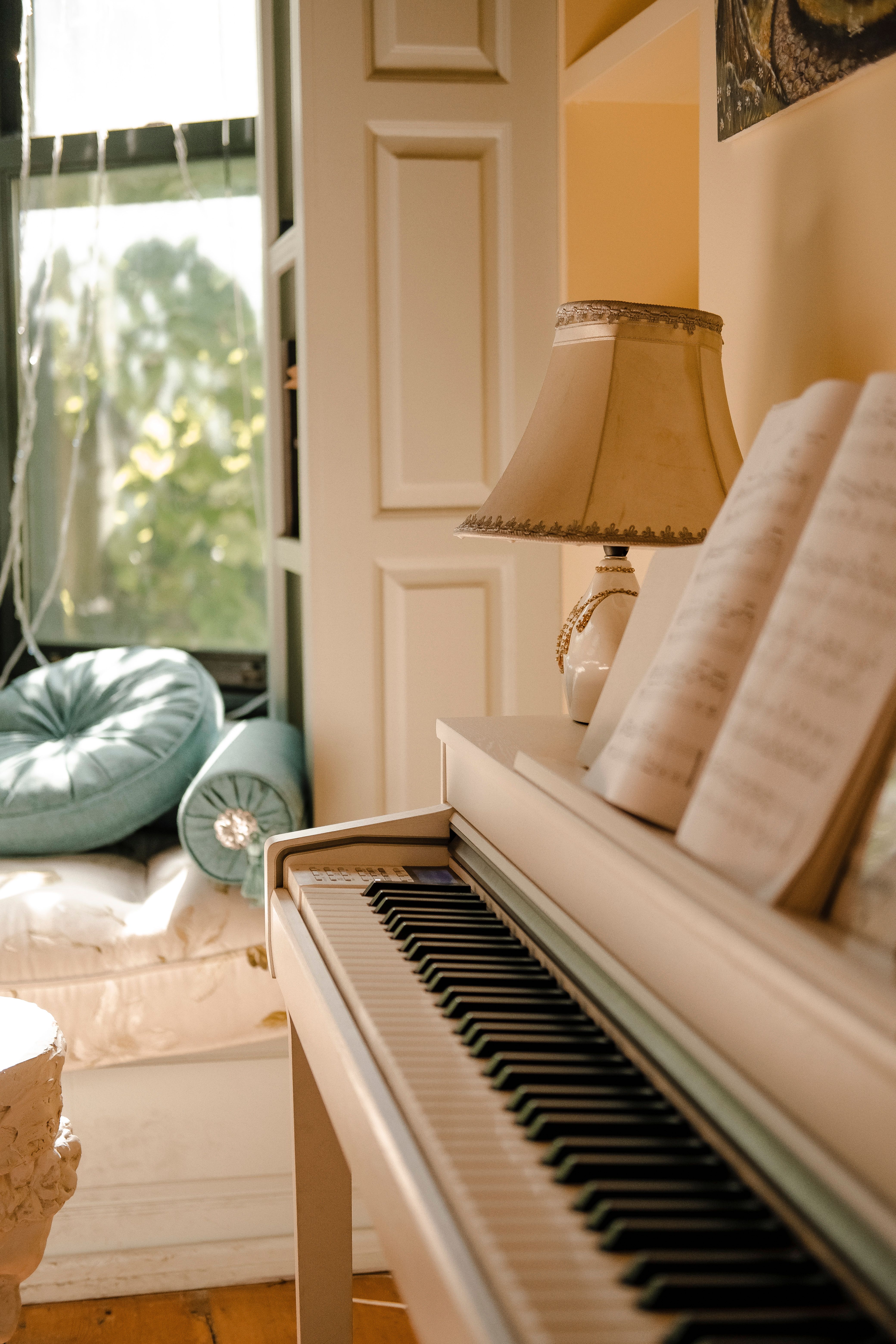 White Piano Standing Indoors · Free Stock Photo