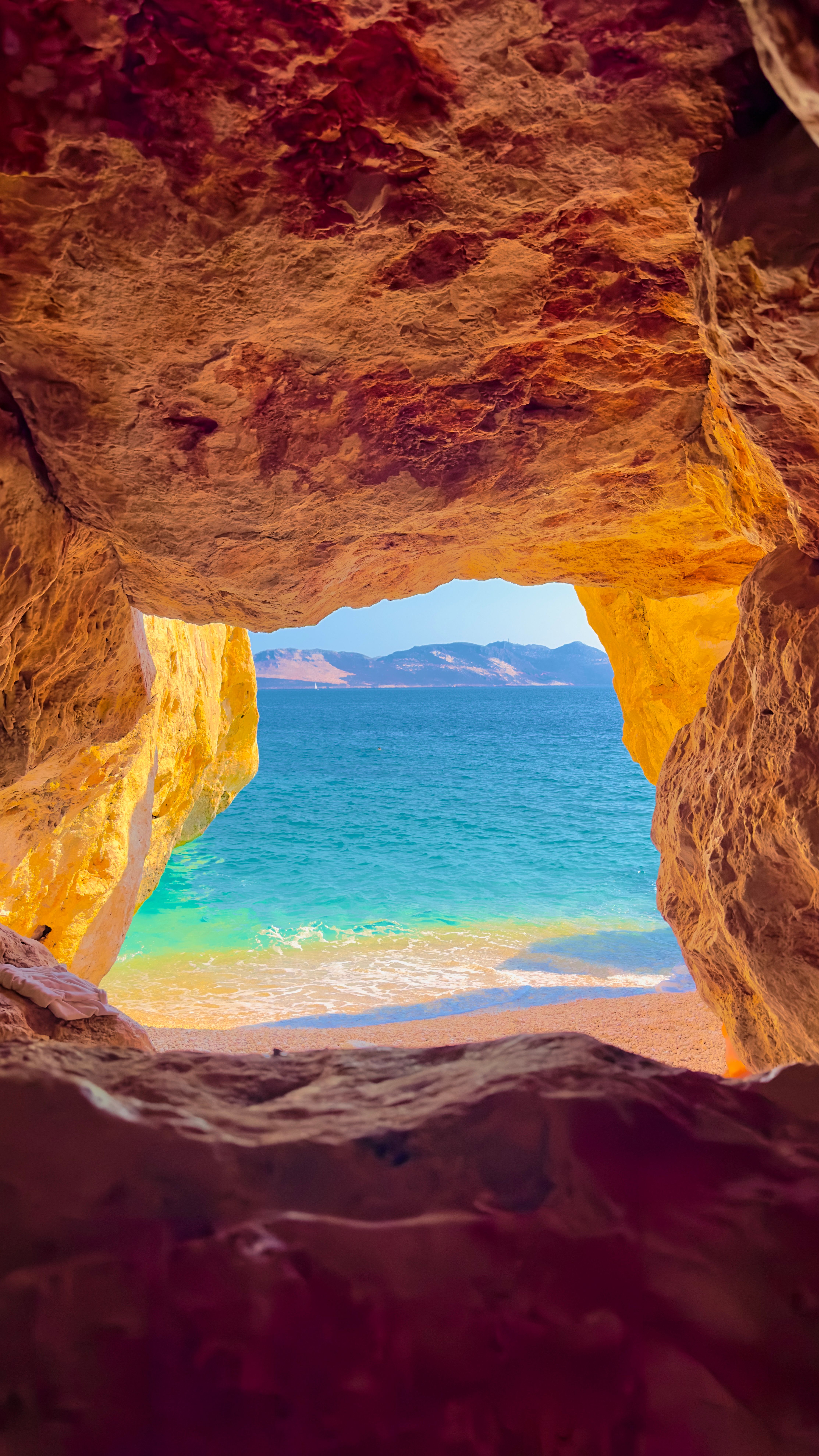 View of Beach and Seashore From Cave · Free Stock Photo
