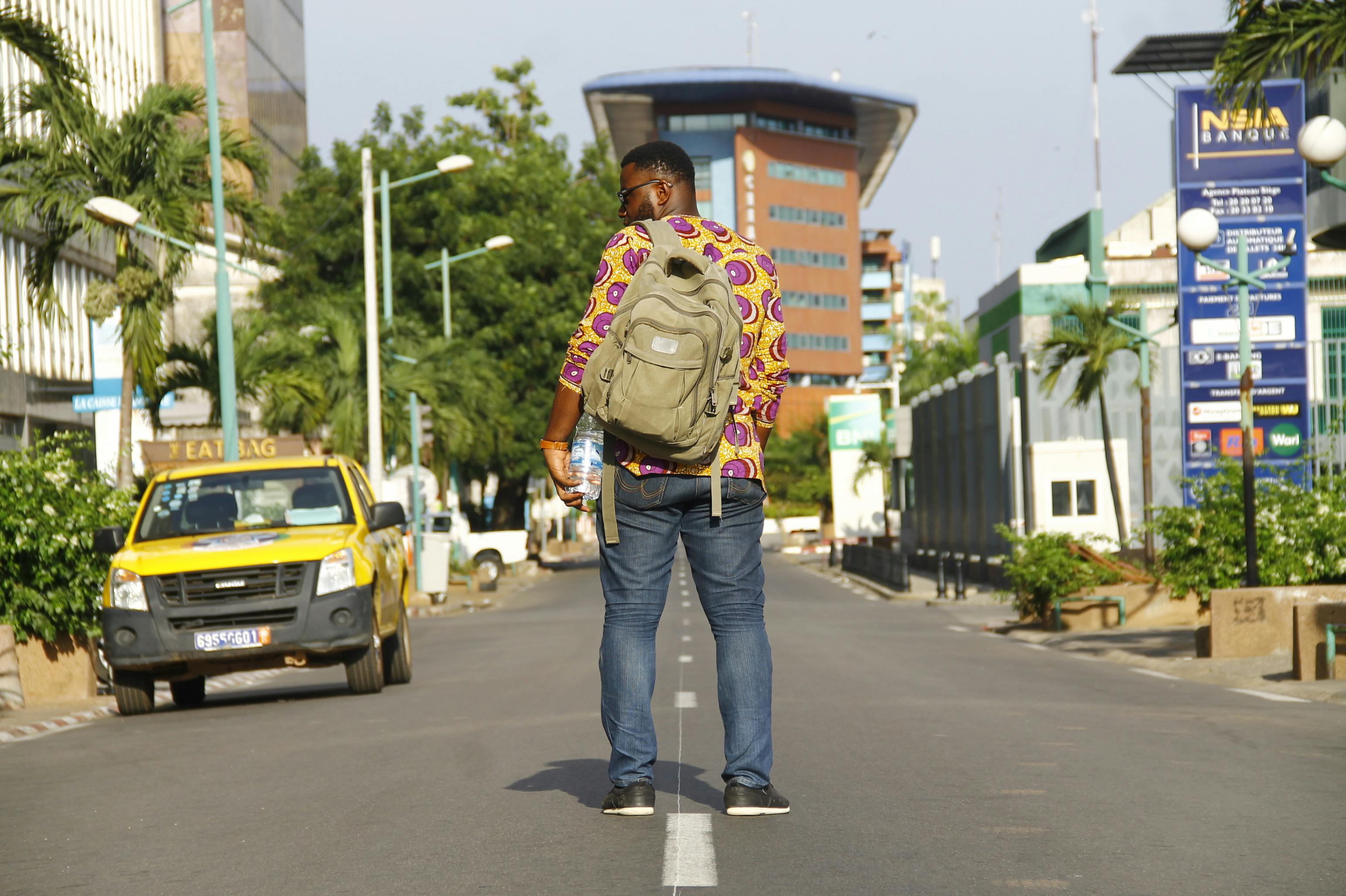 Man Standing in Middle of the Road · Free Stock Photo
