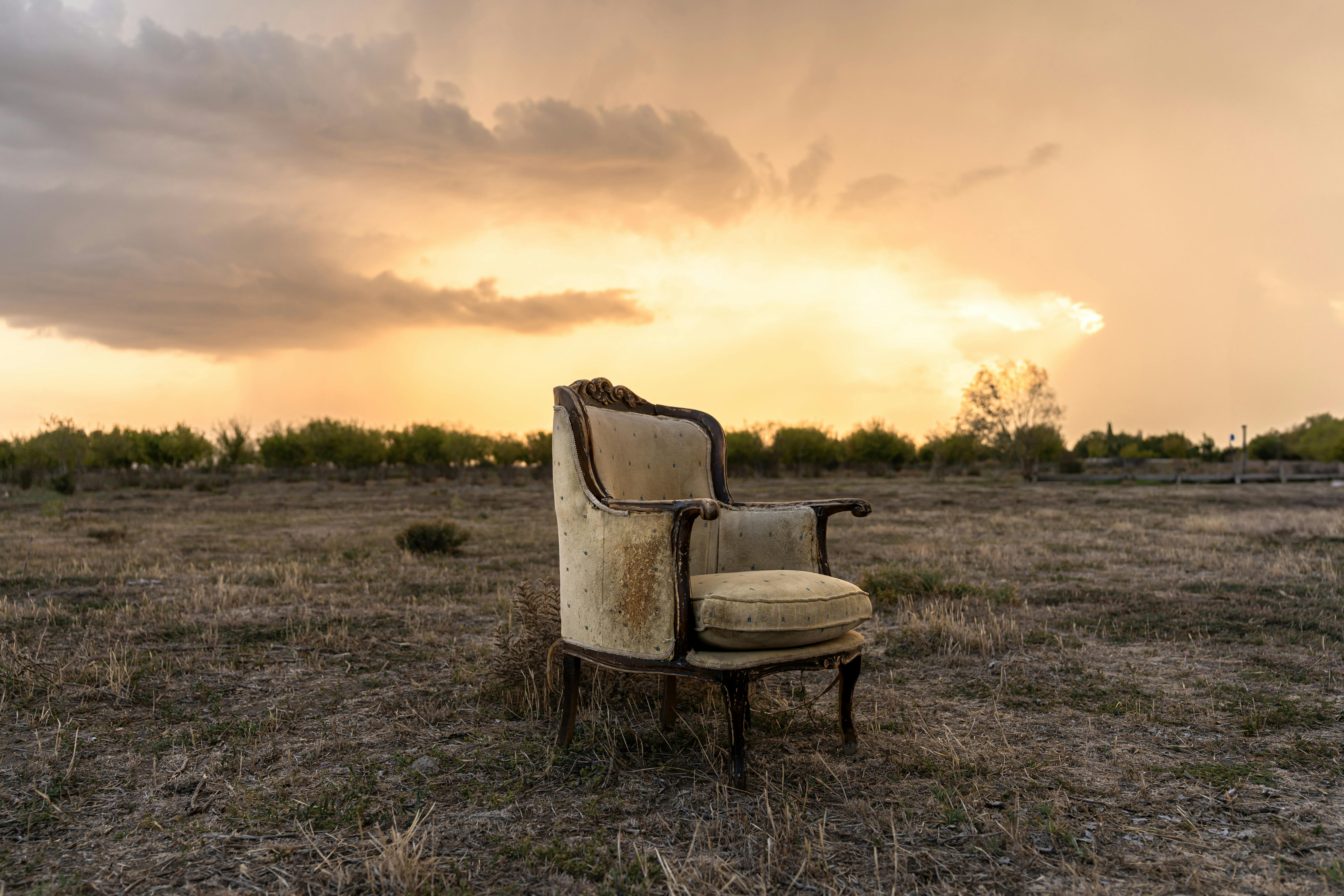 Old Chair in Field at Dusk · Free Stock Photo