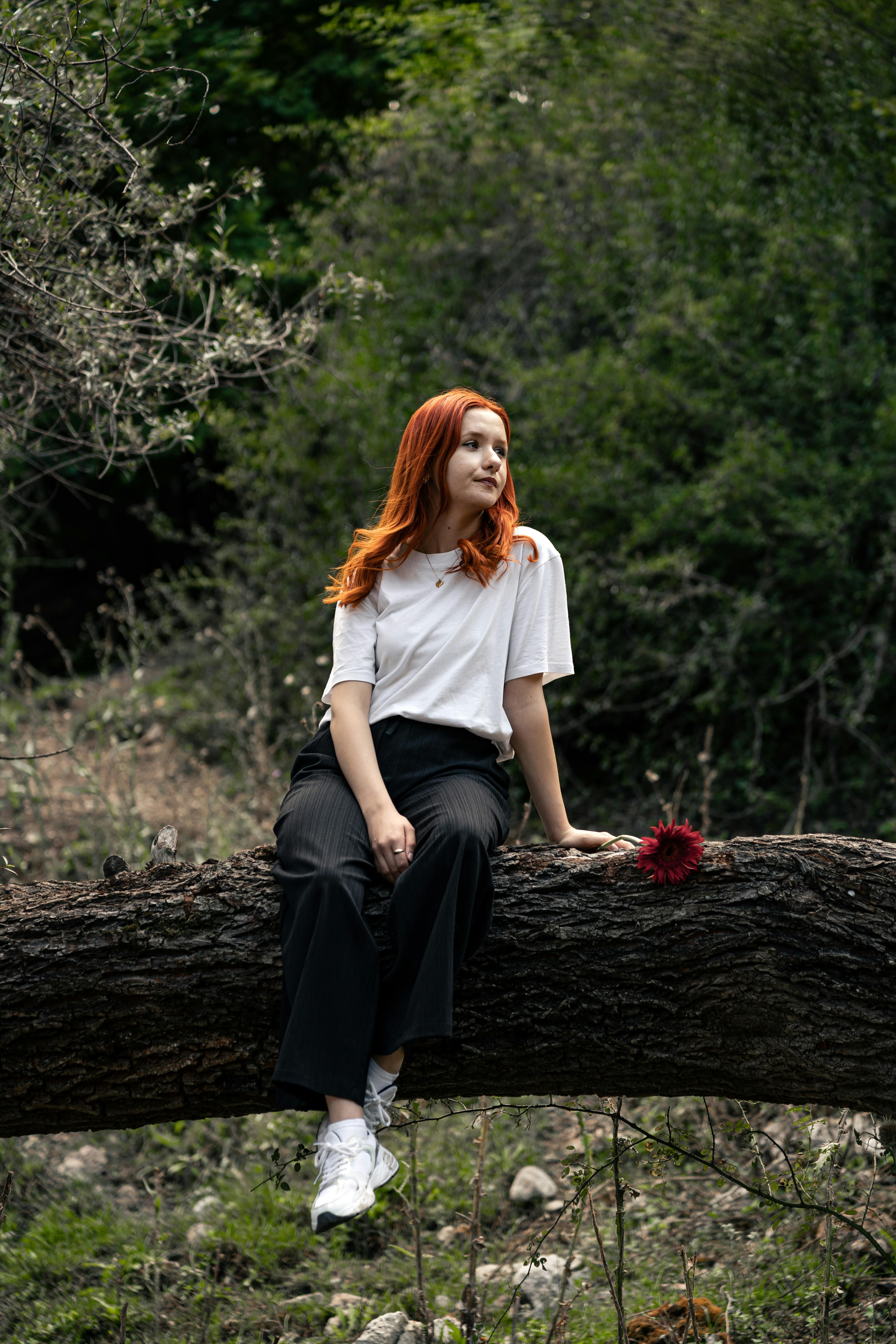Woman in Forest Sitting on Tree Branch · Free Stock Photo