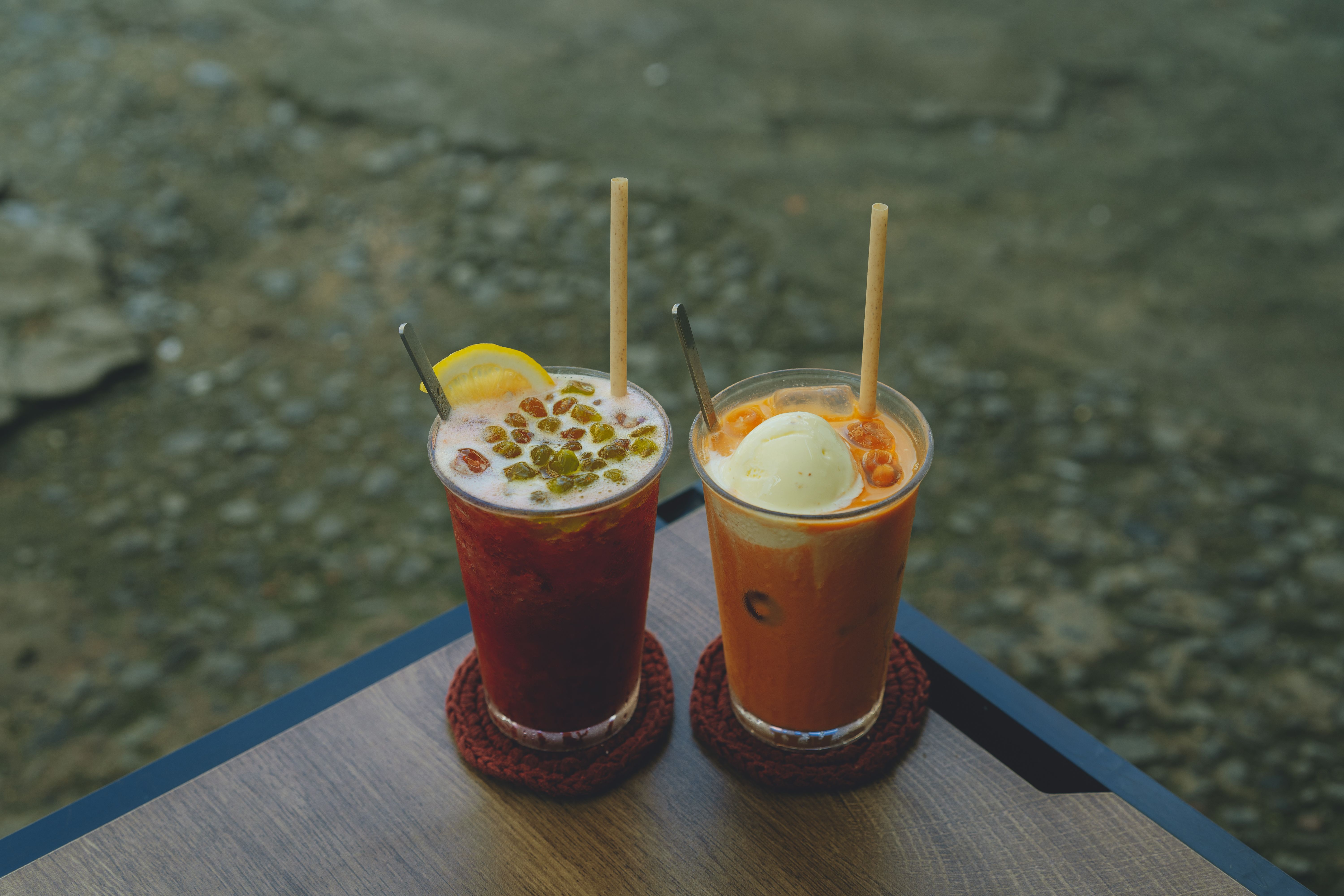 Cold Orange Cocktails in Glasses with Straws on Edge of Table · Free ...