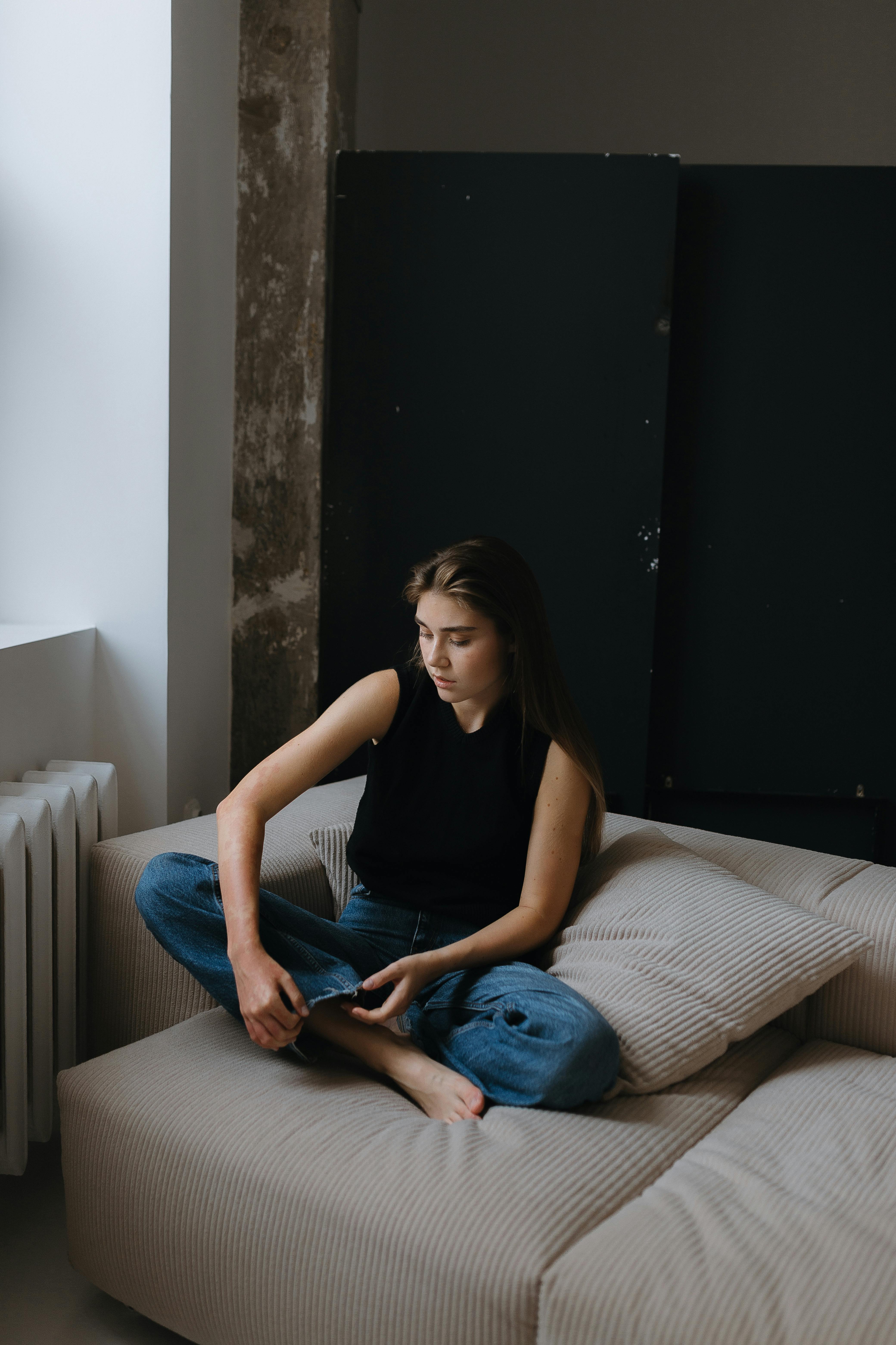 A Woman Sitting on Floor Hugging Leg · Free Stock Photo