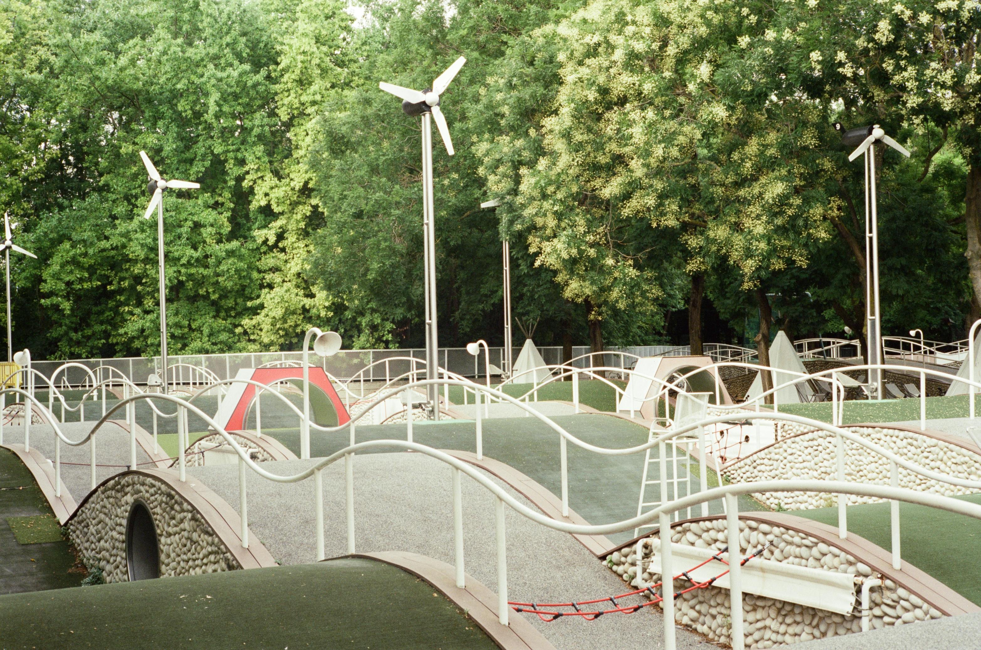 Playground with Wind Turbines in Park Setting · Free Stock Photo