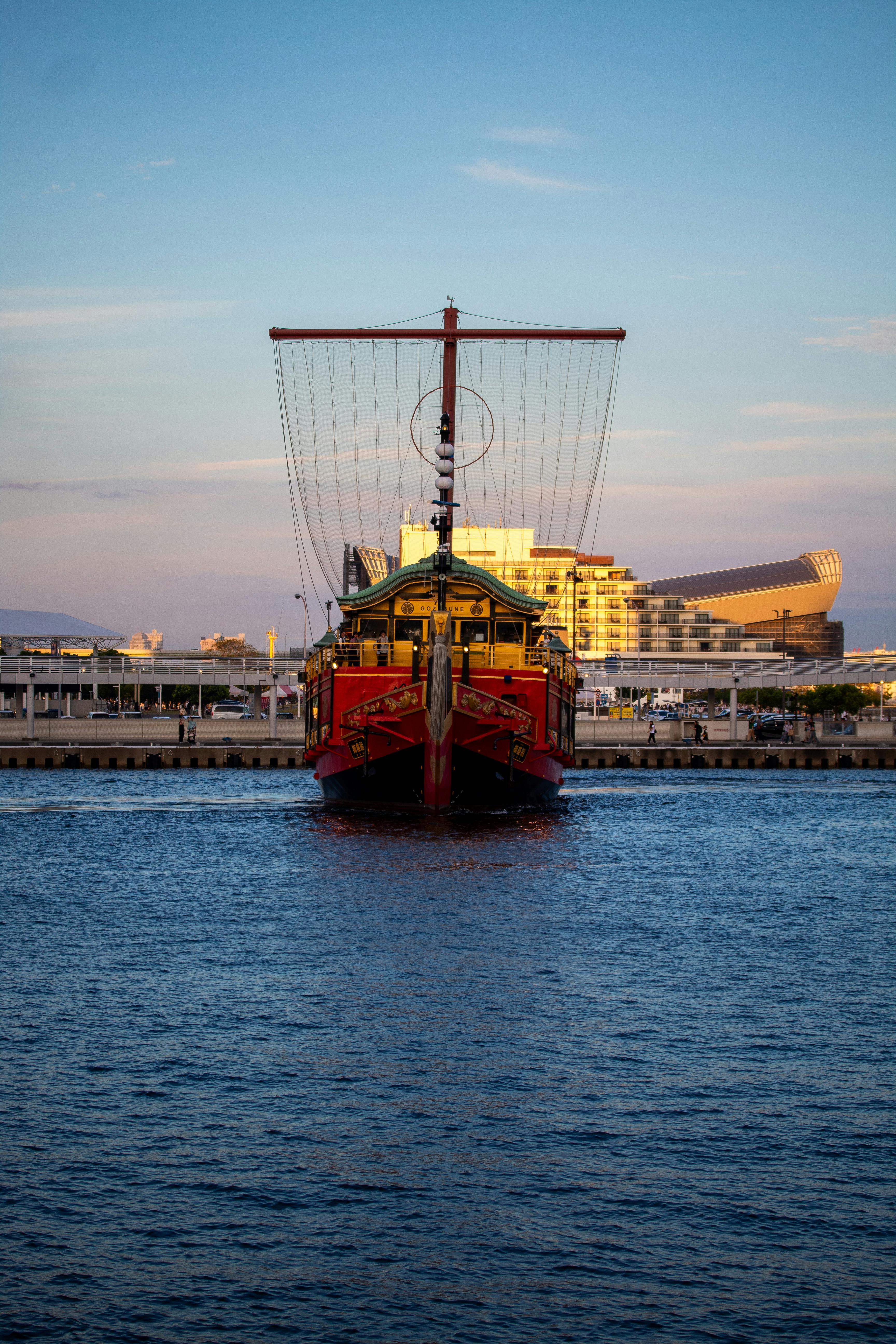 Traditional Japanese Ship Docked at Osaka Harbor During Sunset · Free ...