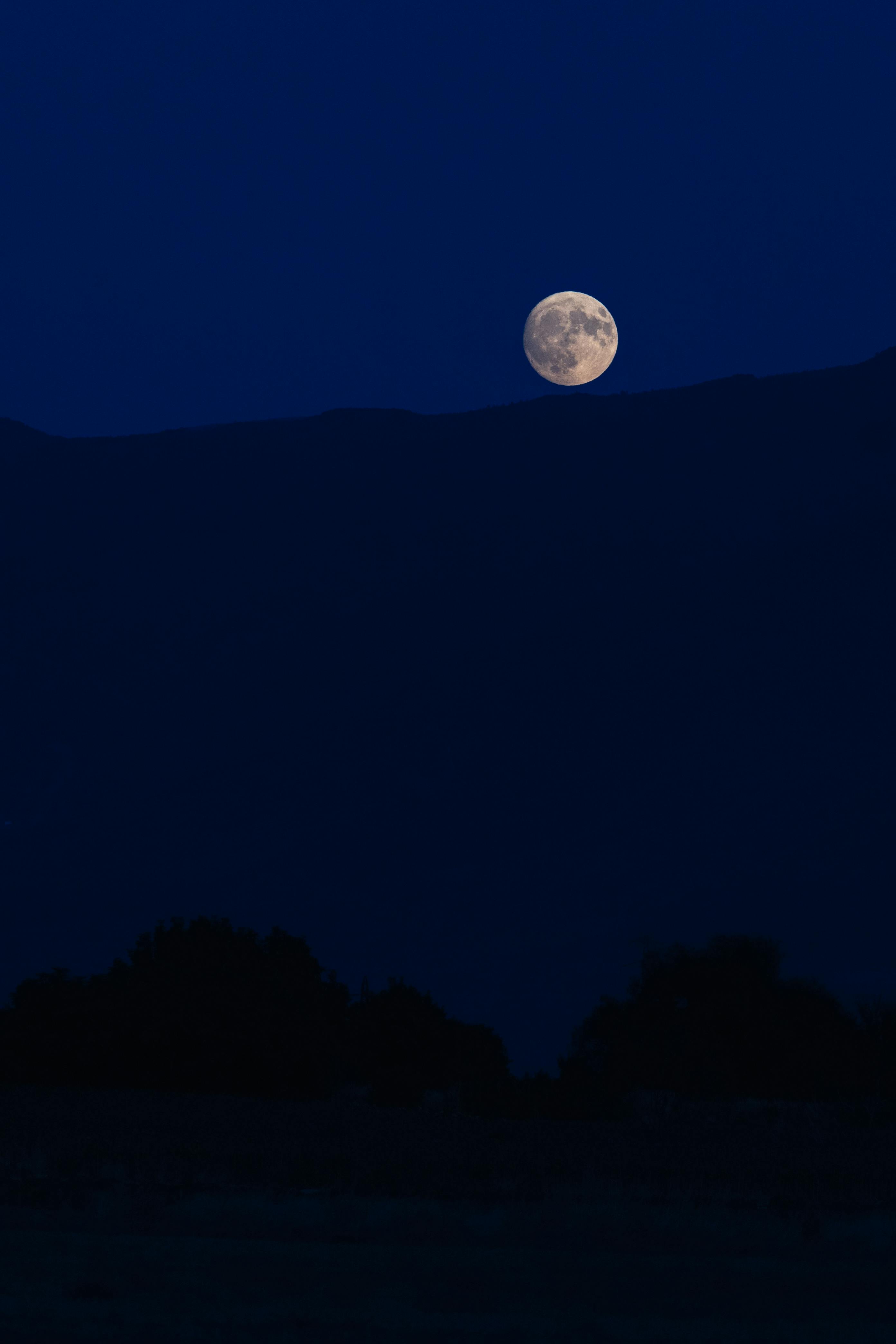 Full Moon Rising Over Mountain Landscape · Free Stock Photo
