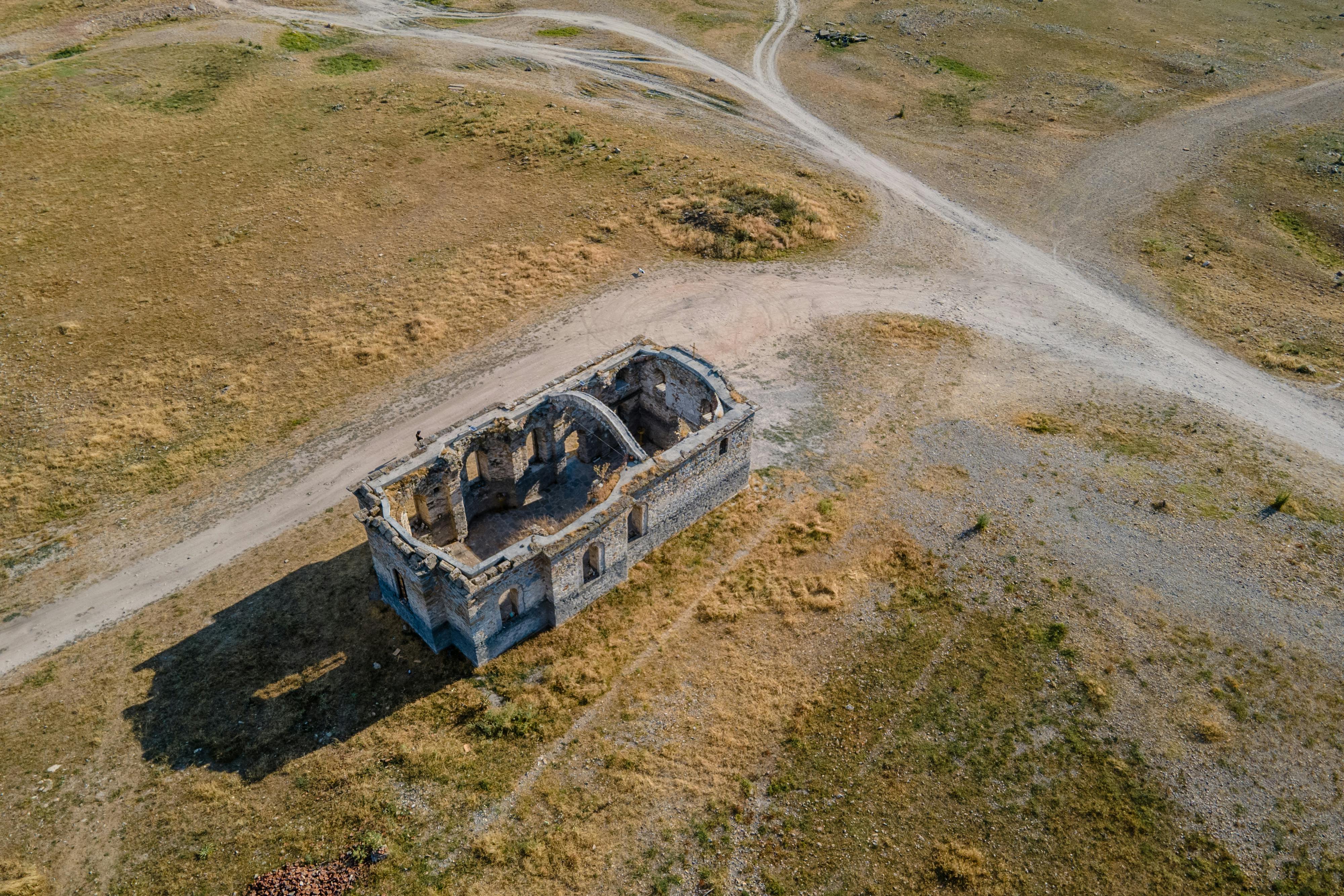 Aerial View of Abandoned Ruins in Desert Landscape · Free Stock Photo