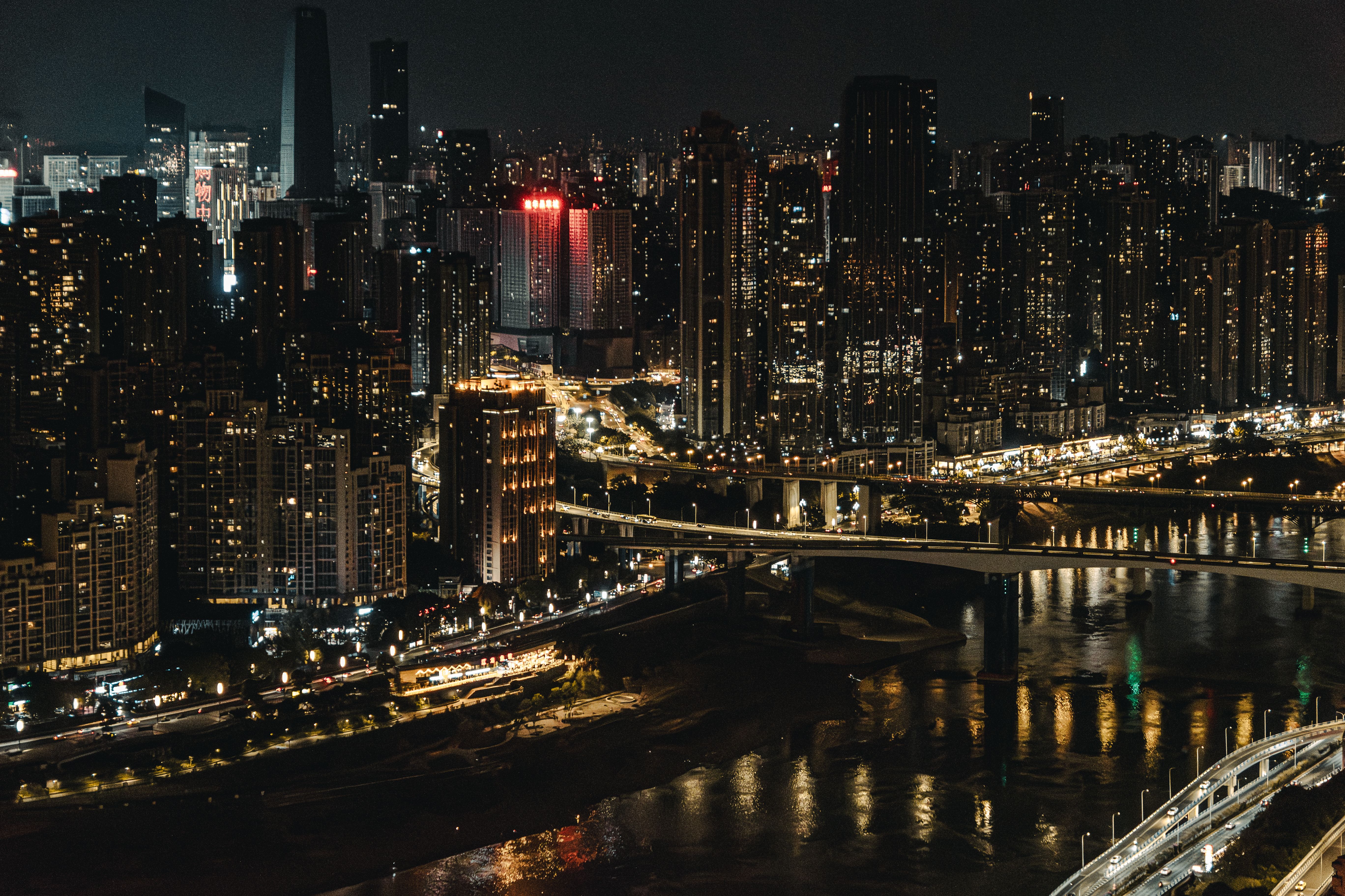 A city at night with lights and buildings · Free Stock Photo