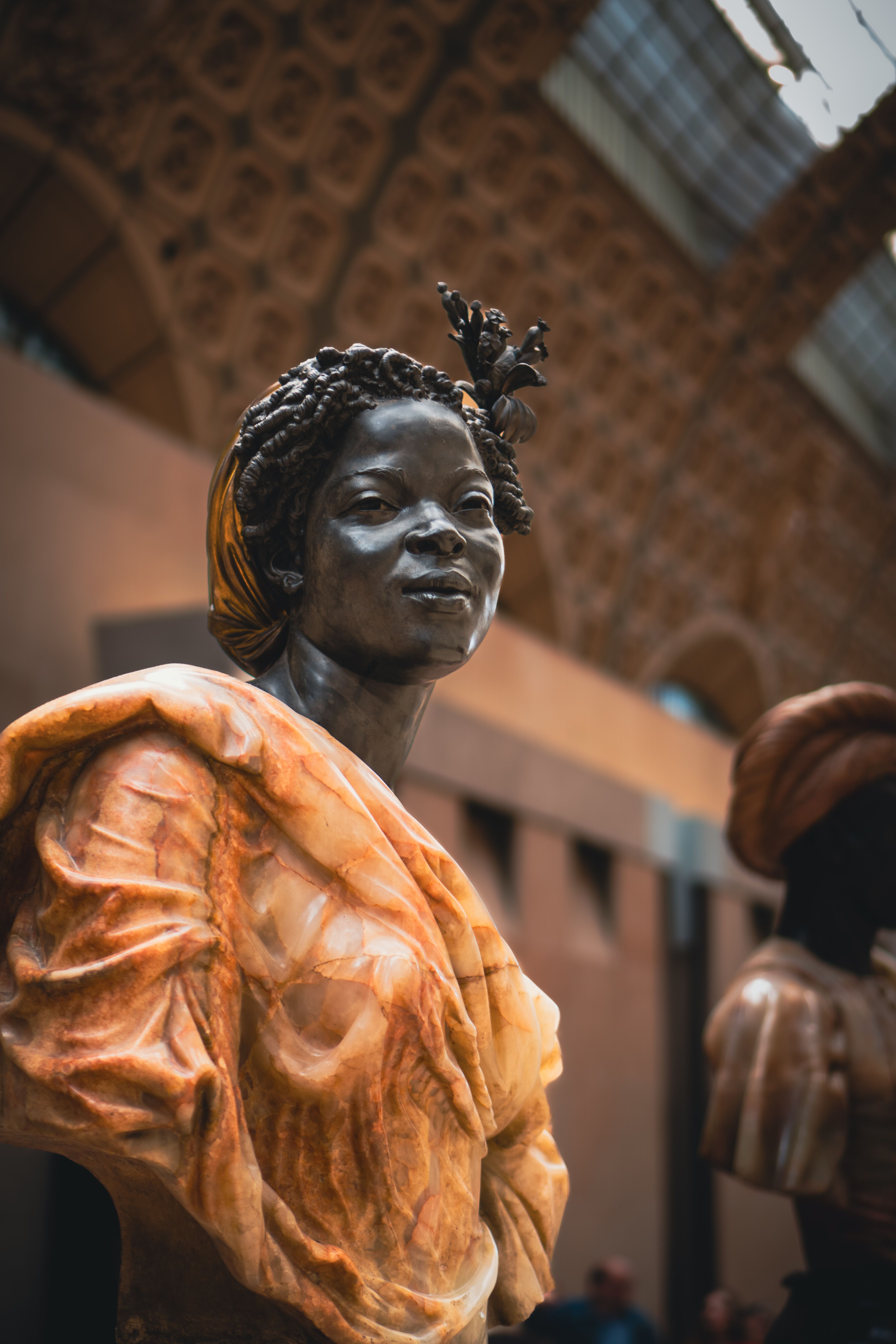 A statue of a woman in a museum · Free Stock Photo