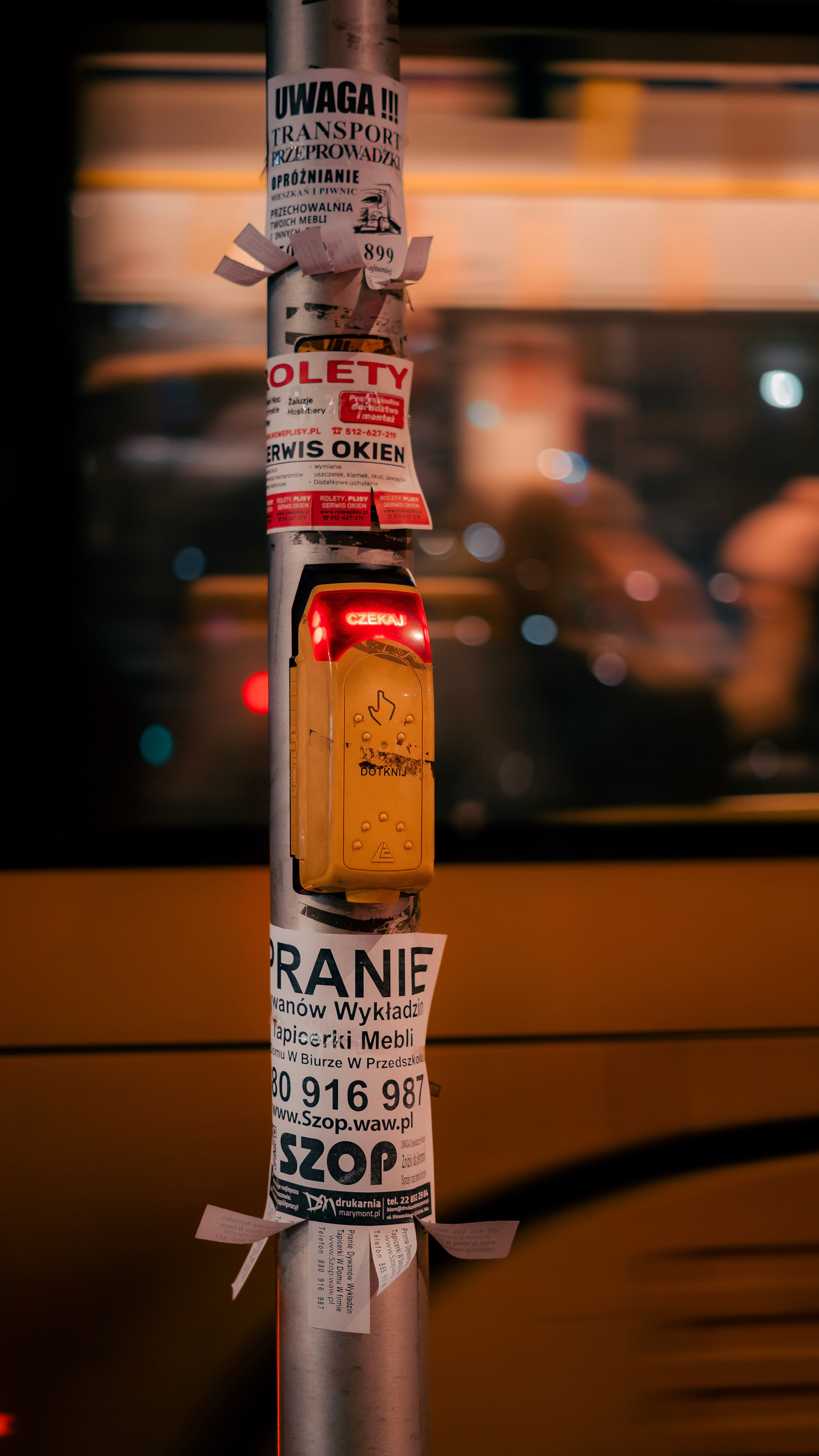 A street pole with a bunch of stickers on it · Free Stock Photo
