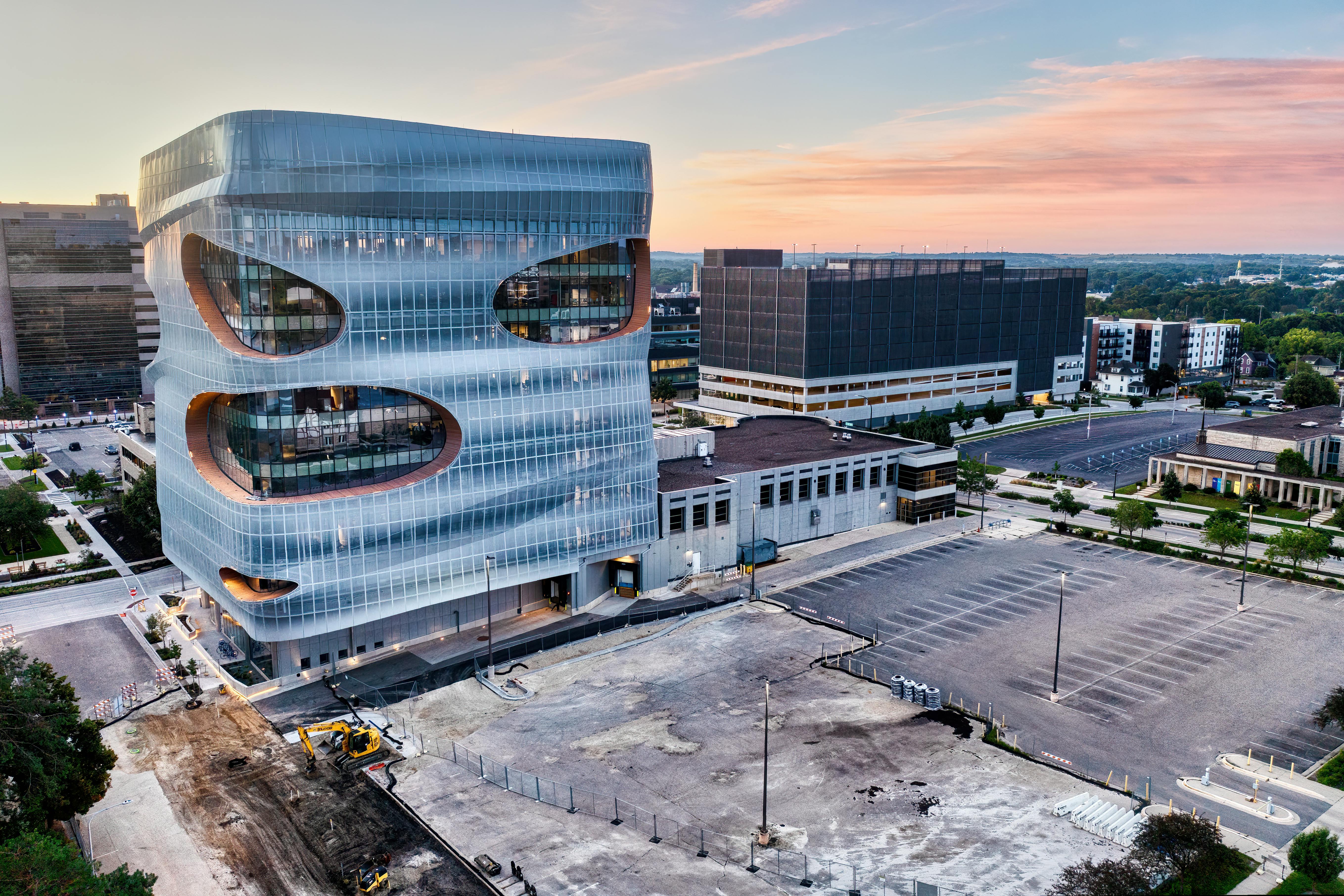 An aerial view of a building with a large glass facade · Free Stock Photo