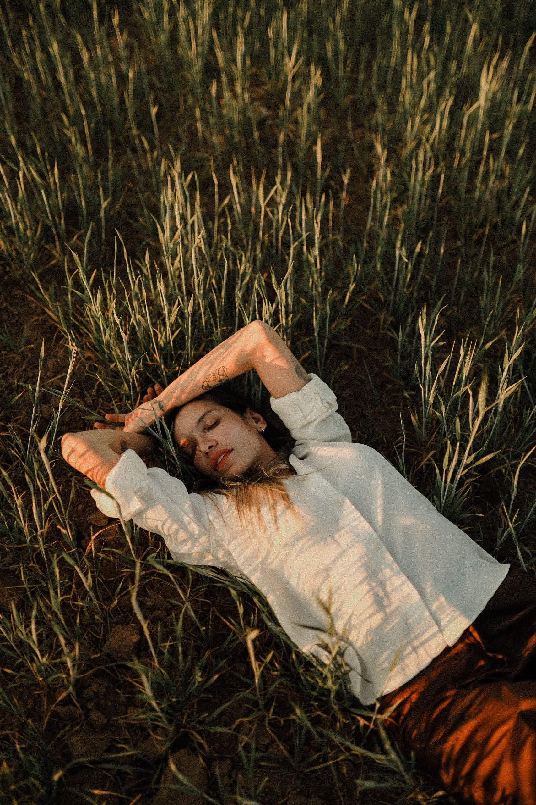 Girl Laying In Field