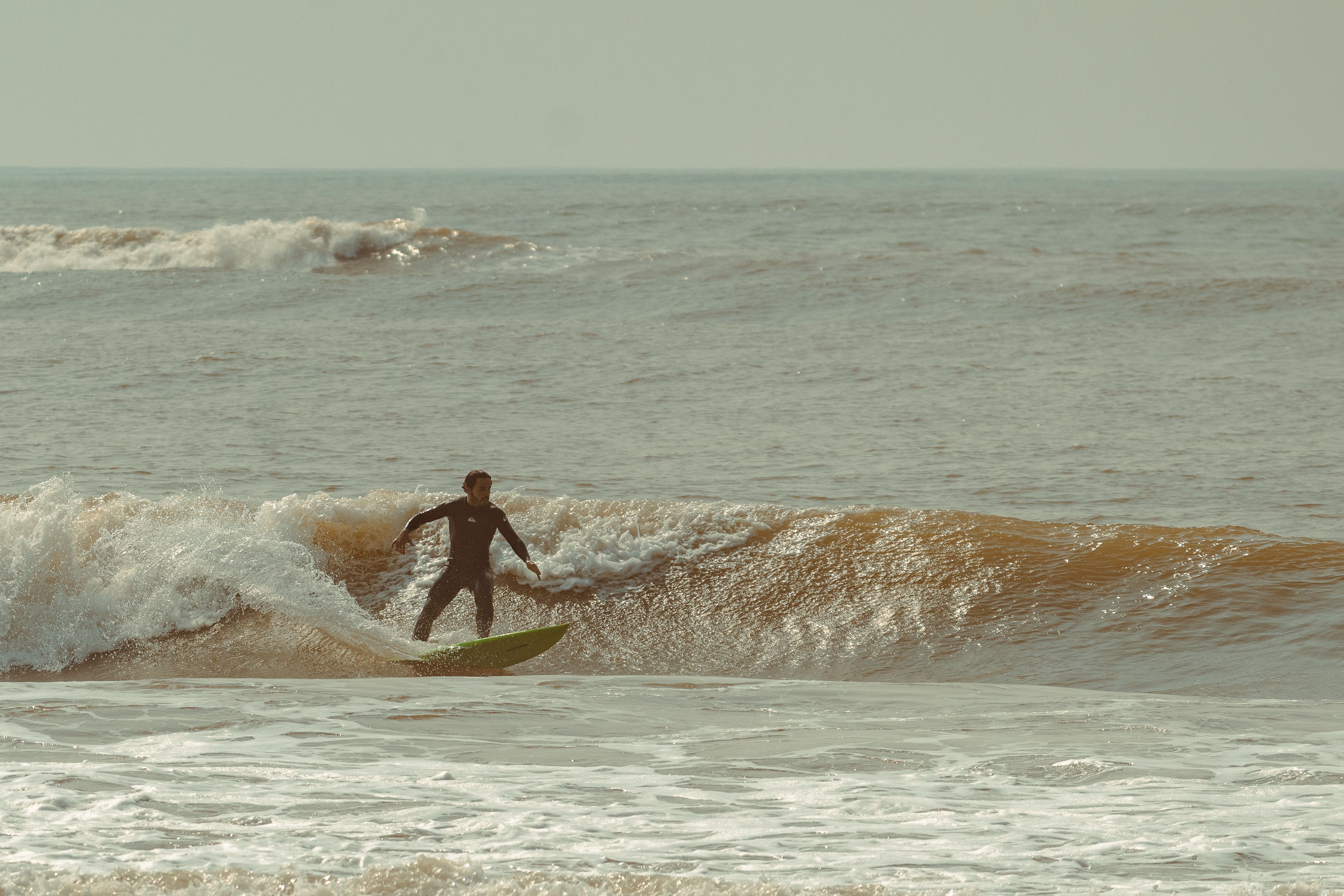Exciting Surfing Adventure on Rolling Waves · Free Stock Photo
