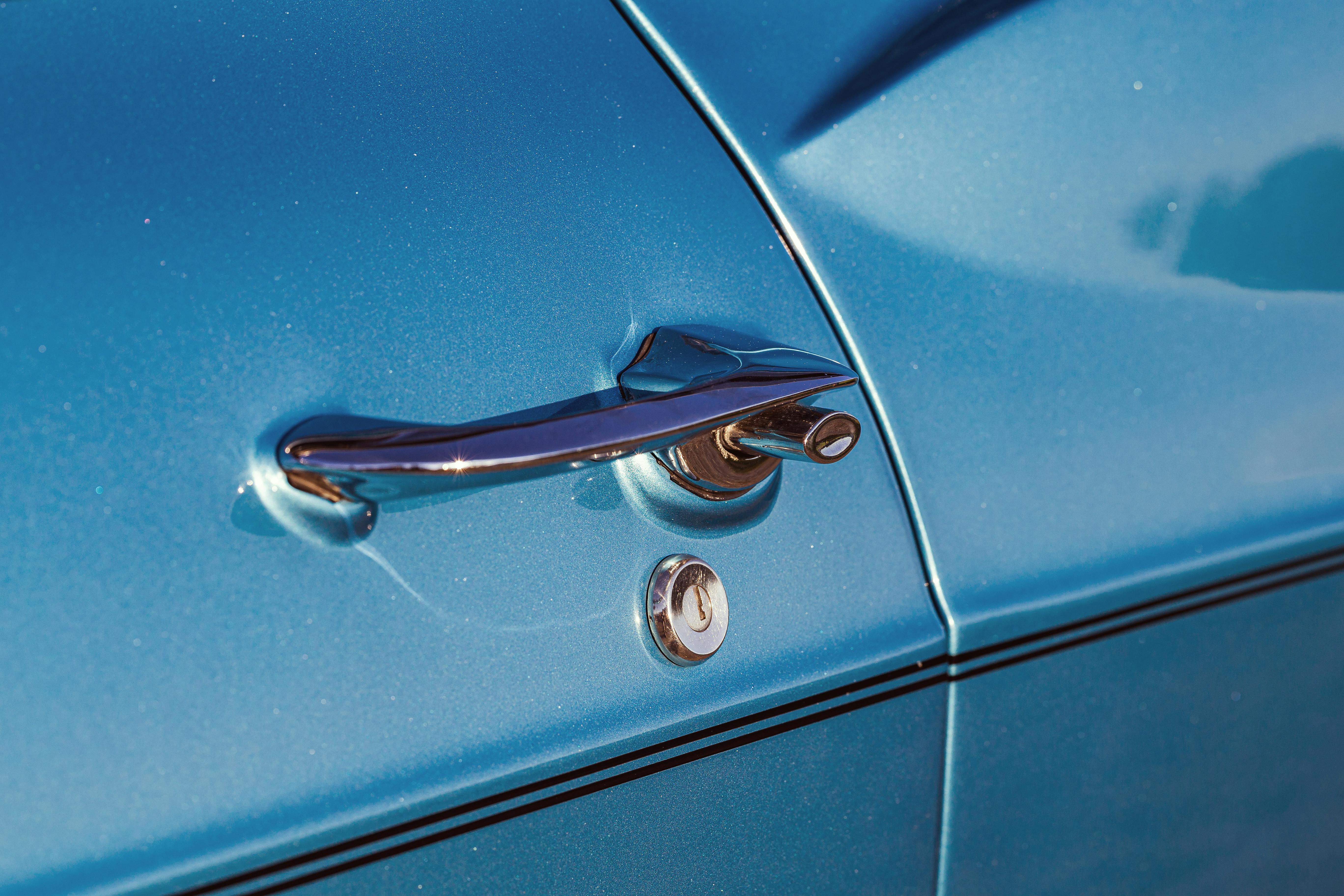 Close-up of a Vintage Blue Car Door Handle · Free Stock Photo