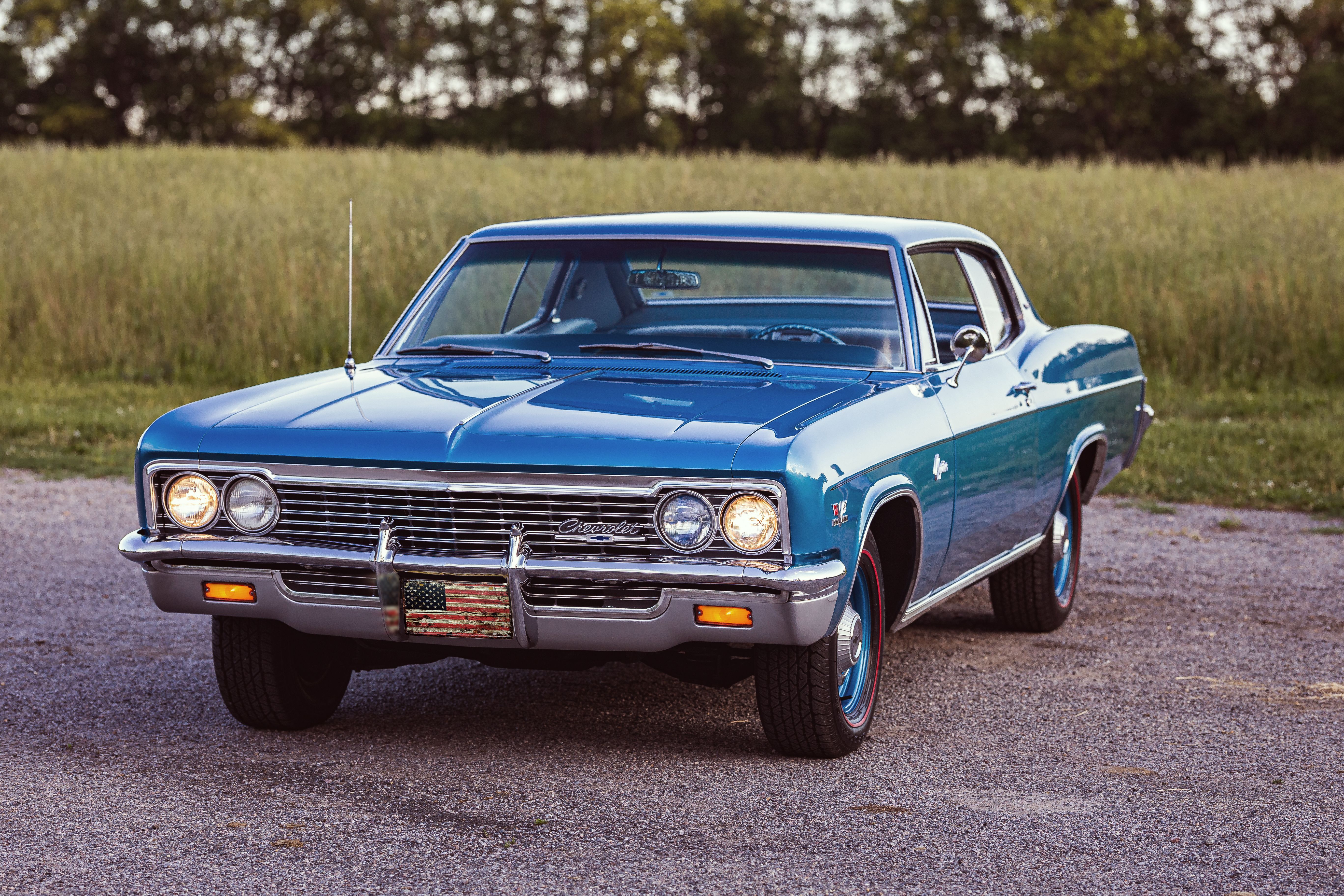 Vintage 1966 Chevrolet Caprice on Open Road · Free Stock Photo