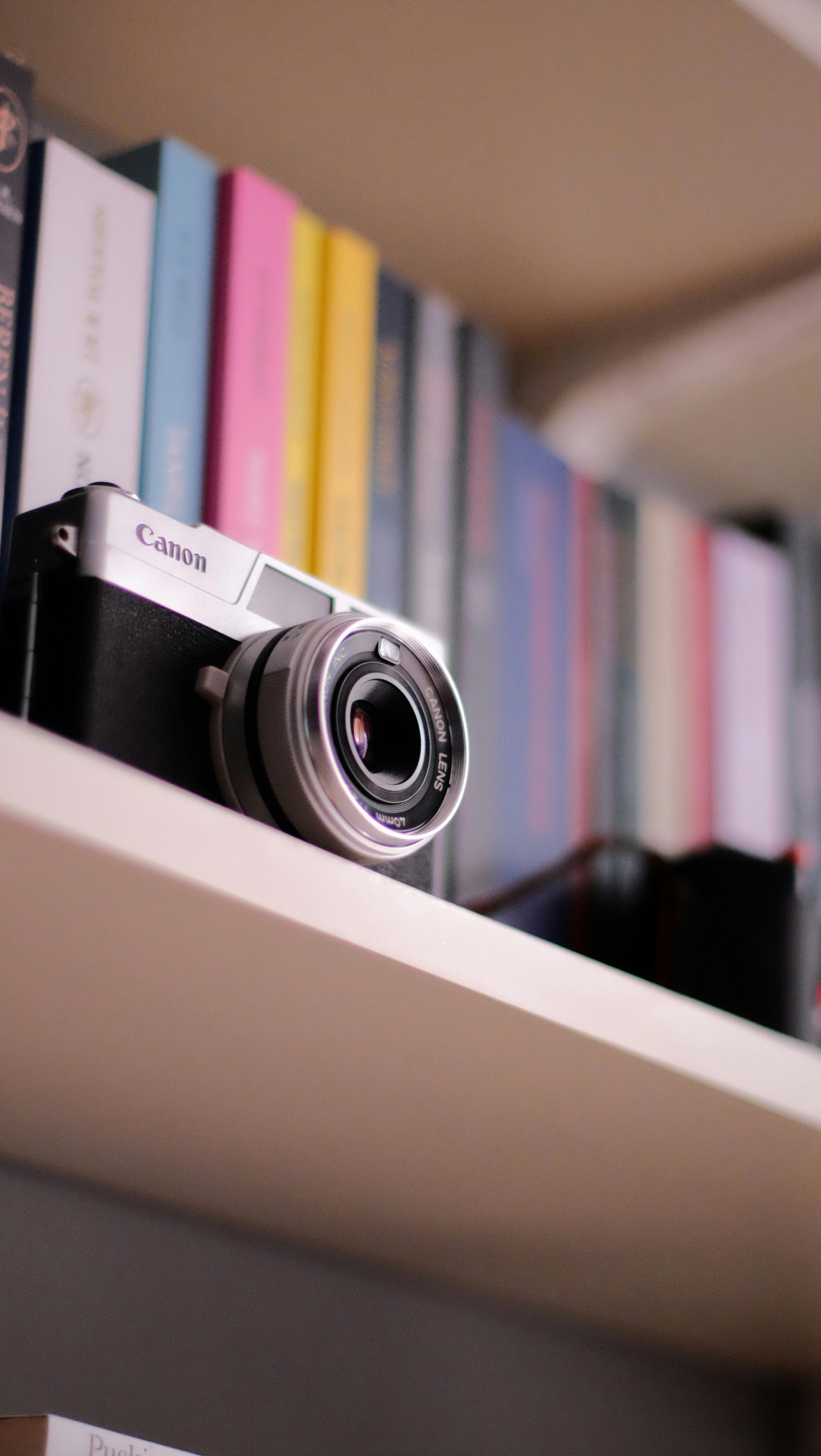 Vintage Camera on Bookshelf in Cozy Home Library · Free Stock Photo