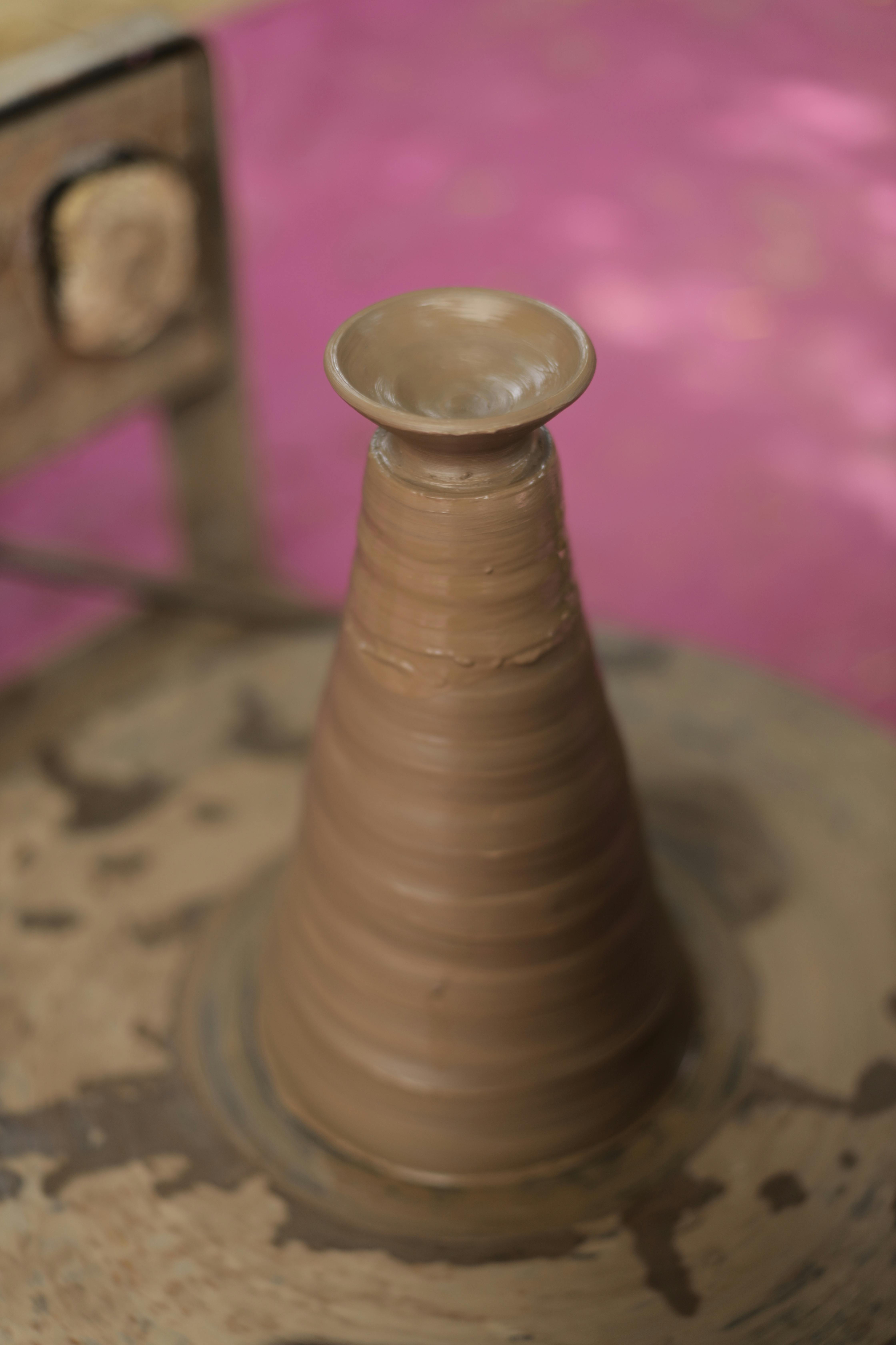 Handcrafted Clay Vase on Pottery Wheel · Free Stock Photo