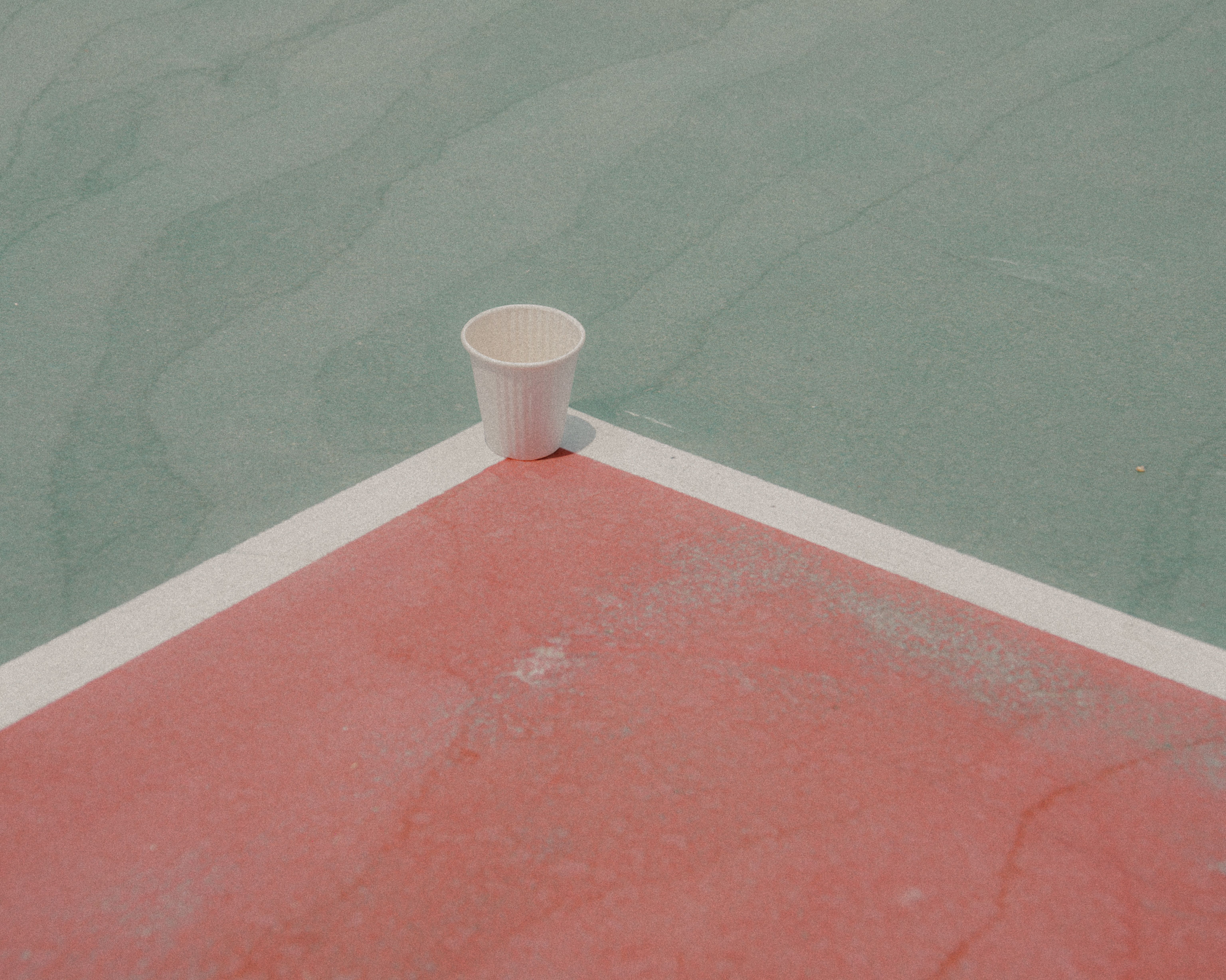 A cup of coffee on a tennis court · Free Stock Photo