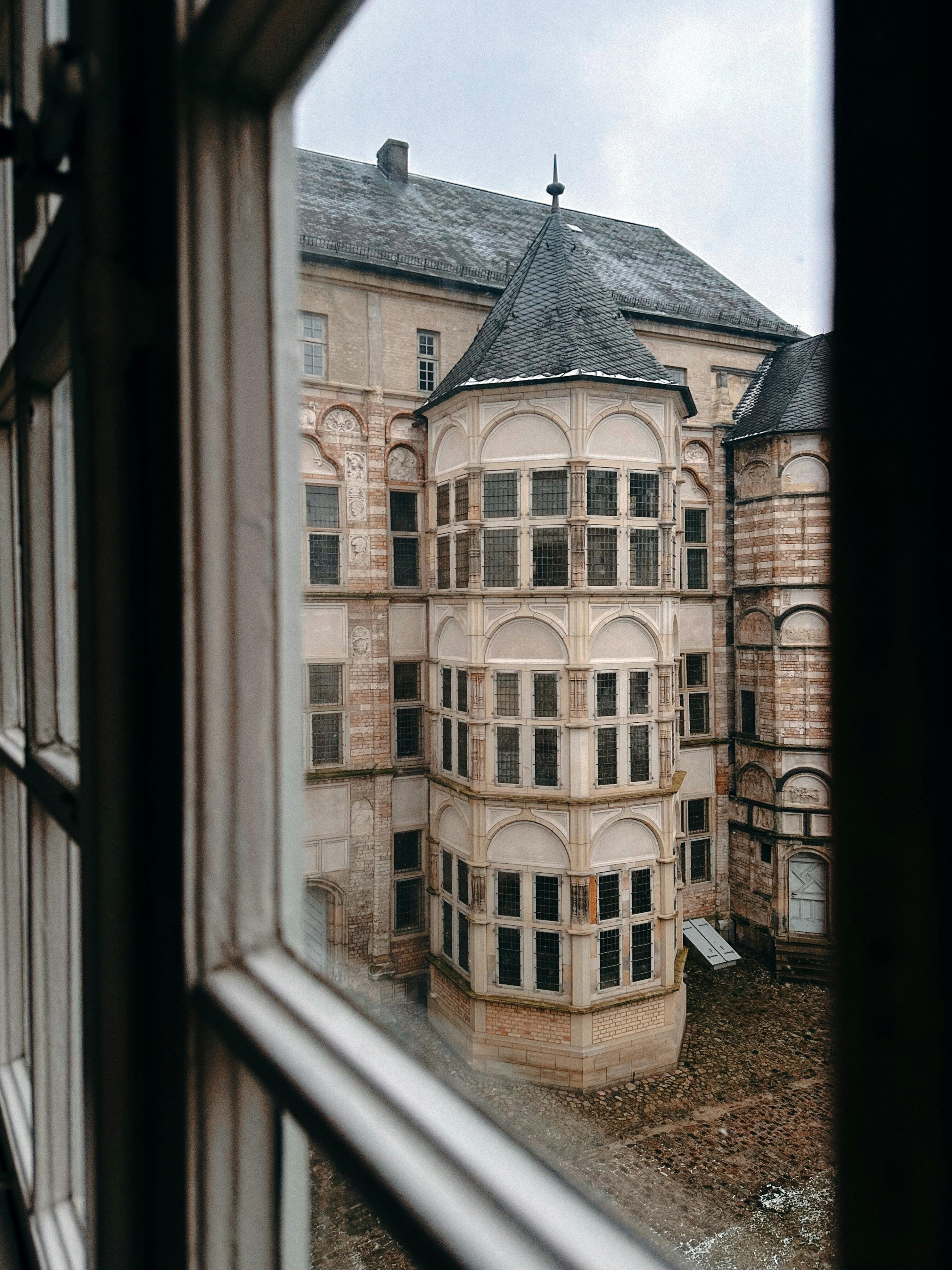 Old Medieval Castle Tower from a Window in Kiel, Germany · Free Stock Photo