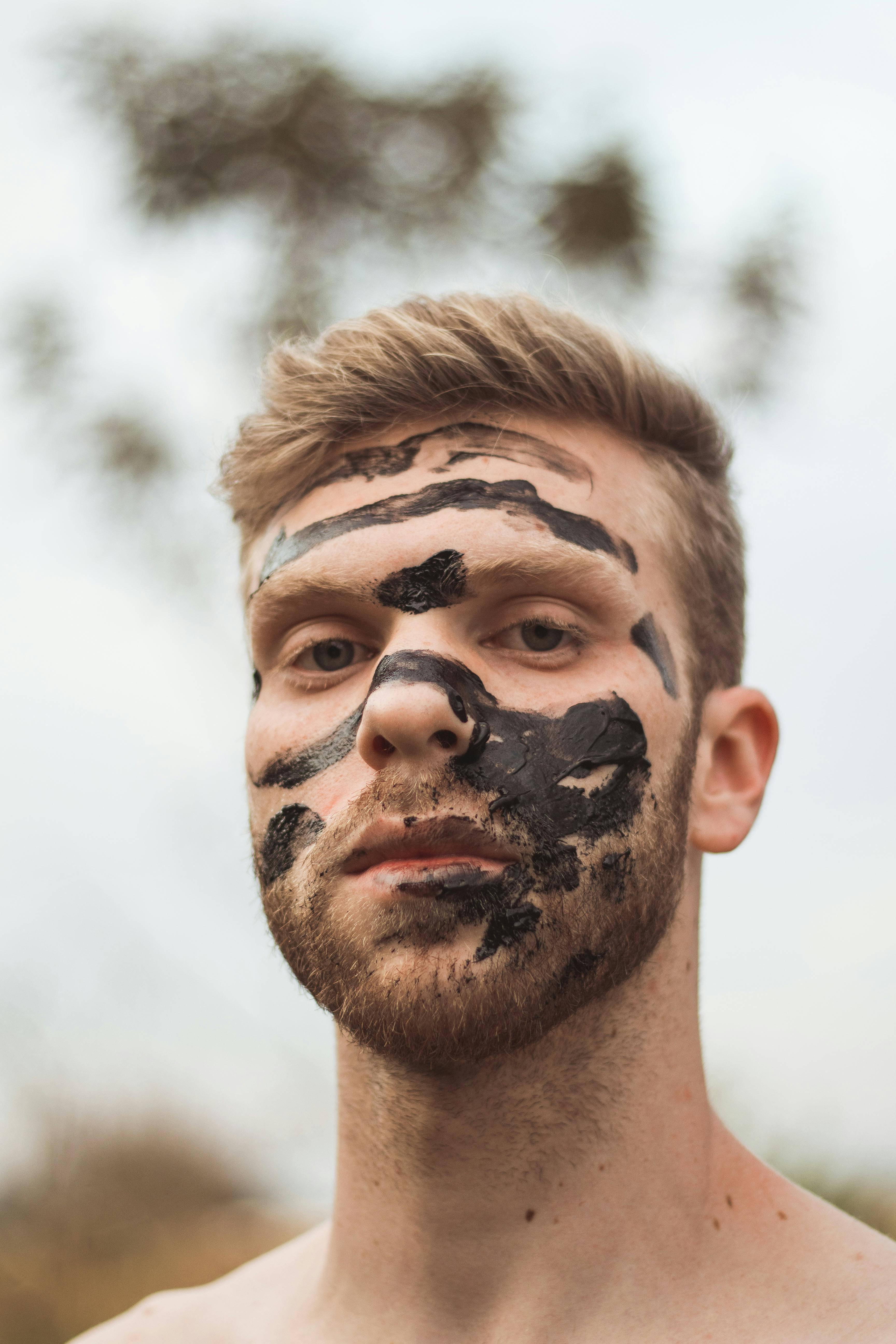 Close-Up Photo of Man With Blue Face Paint · Free Stock Photo