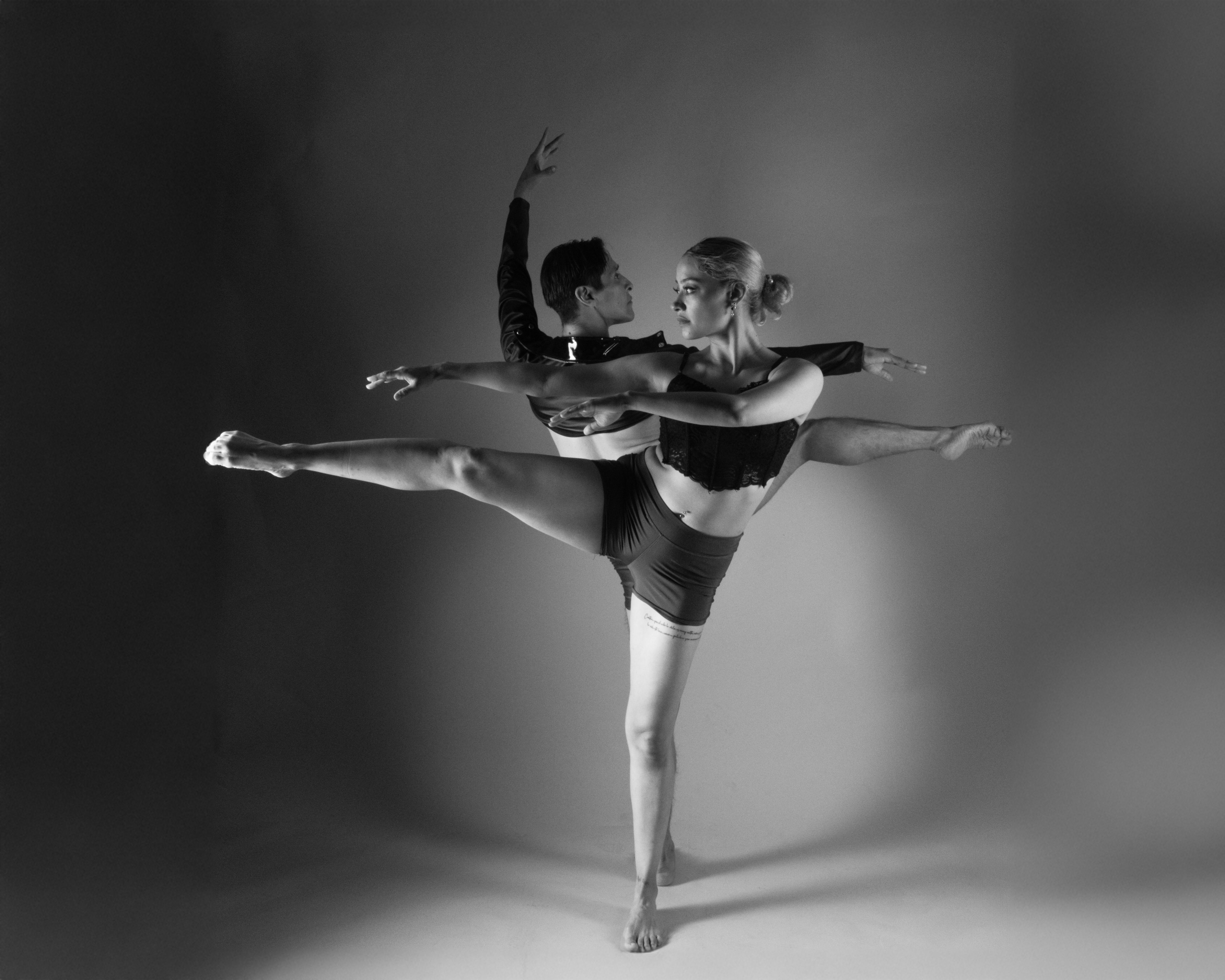 Two dancers in black and white pose for a photo · Free Stock Photo