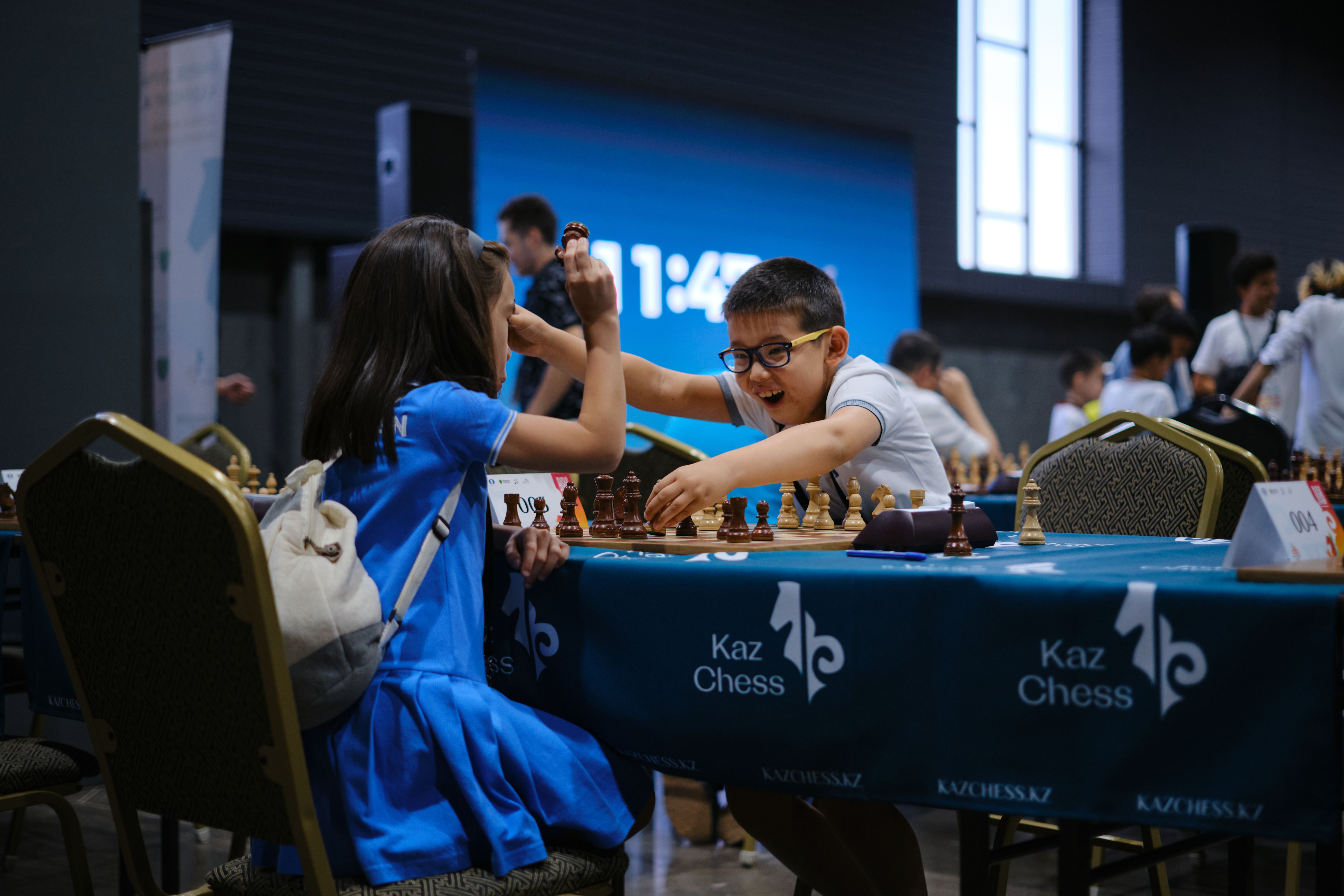 Children Playing Chess in a Tournament Setting · Free Stock Photo