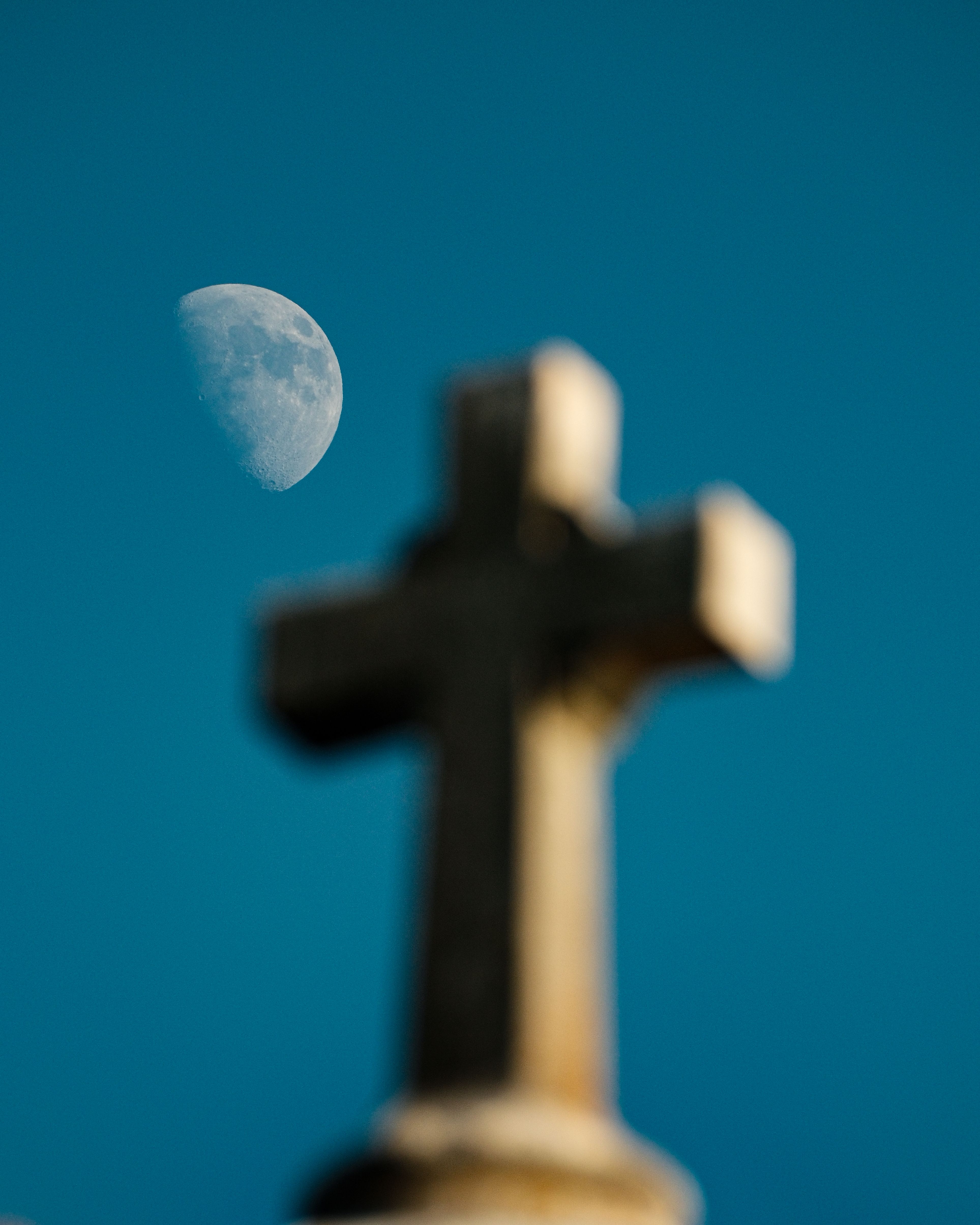 Moonlit Cross Against a Clear Blue Sky · Free Stock Photo