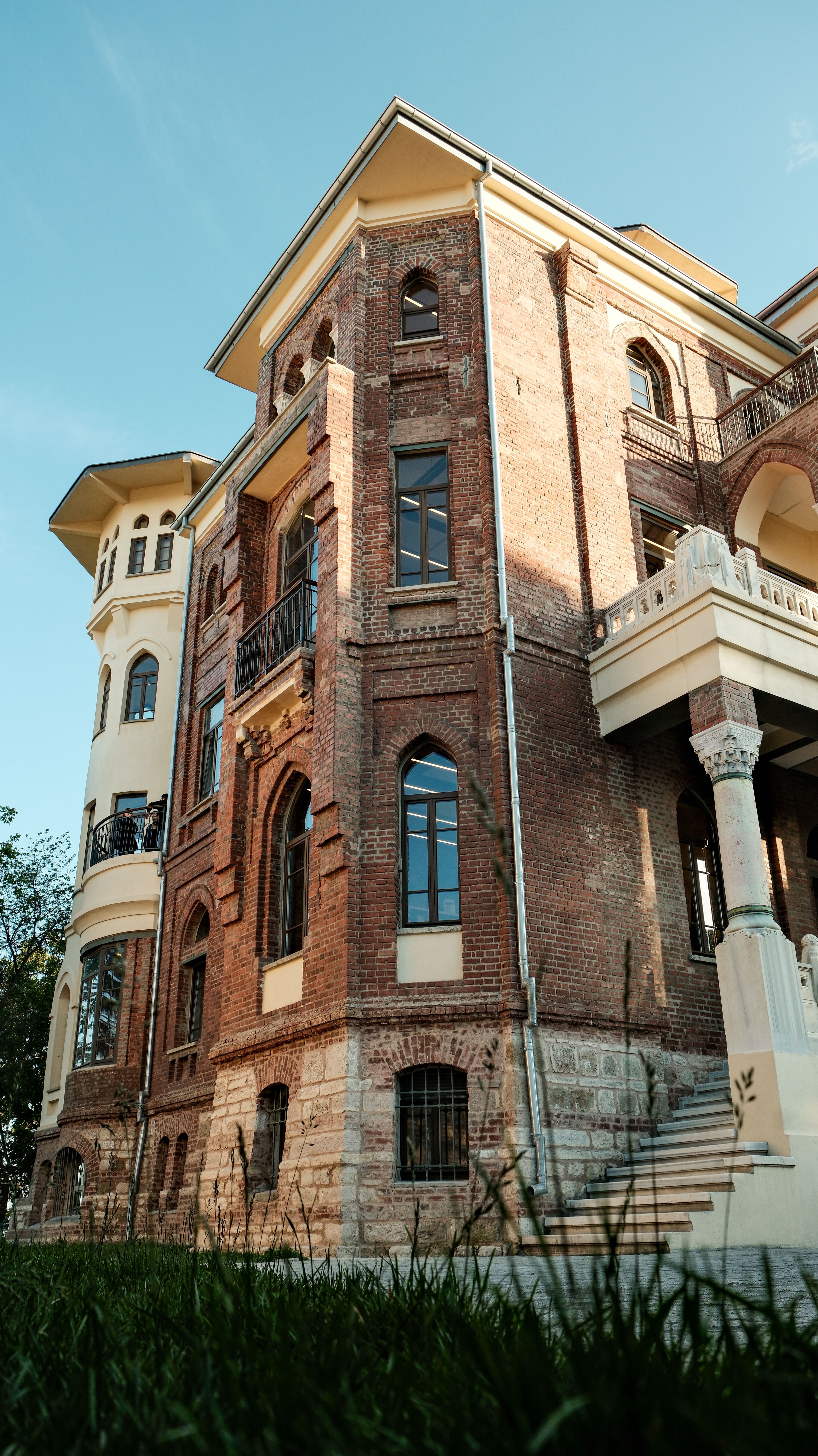 Historic Brick Building with Ornate Architecture · Free Stock Photo