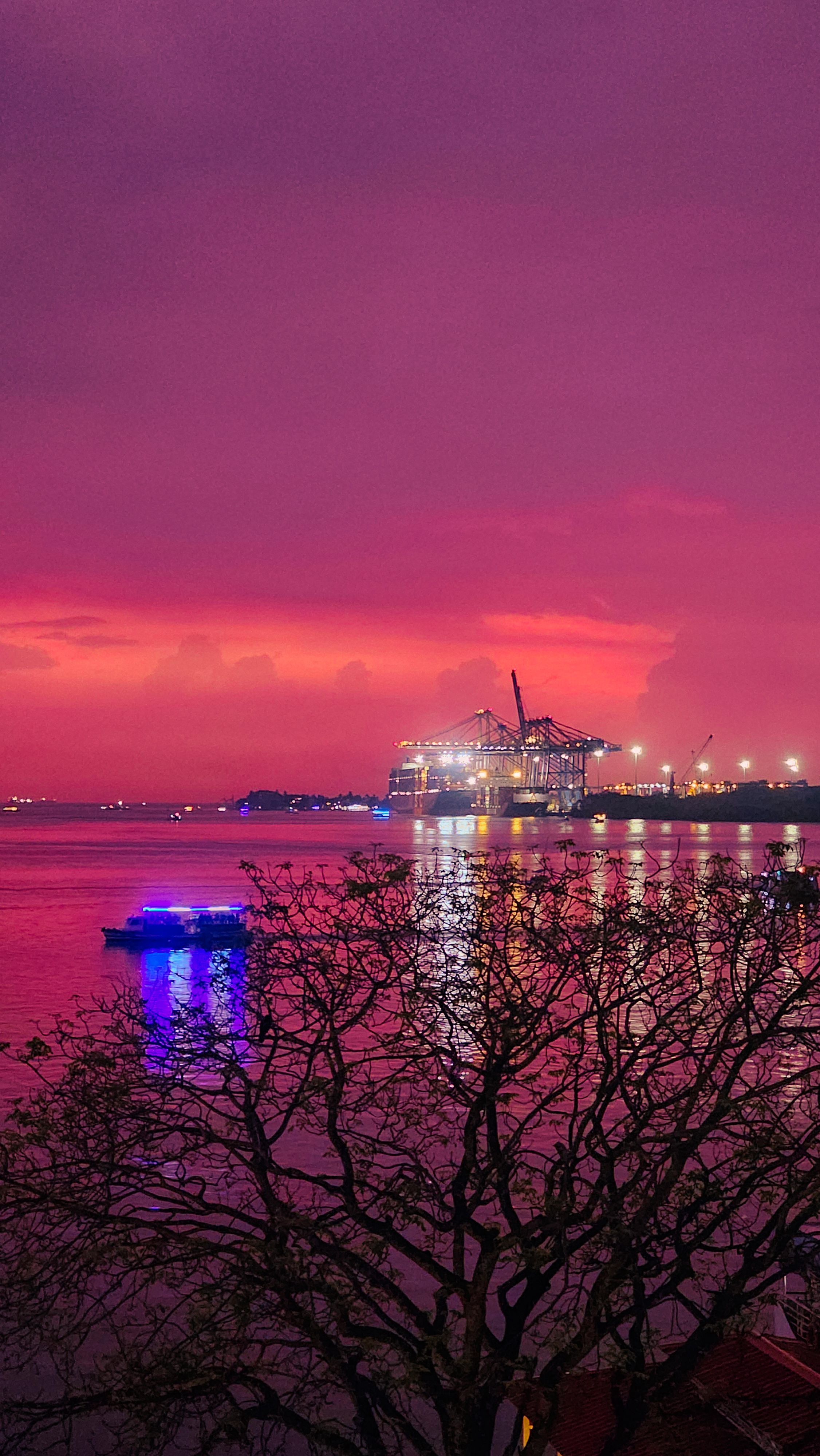 Vibrant Port Sunset Over Industrial Harbor · Free Stock Photo