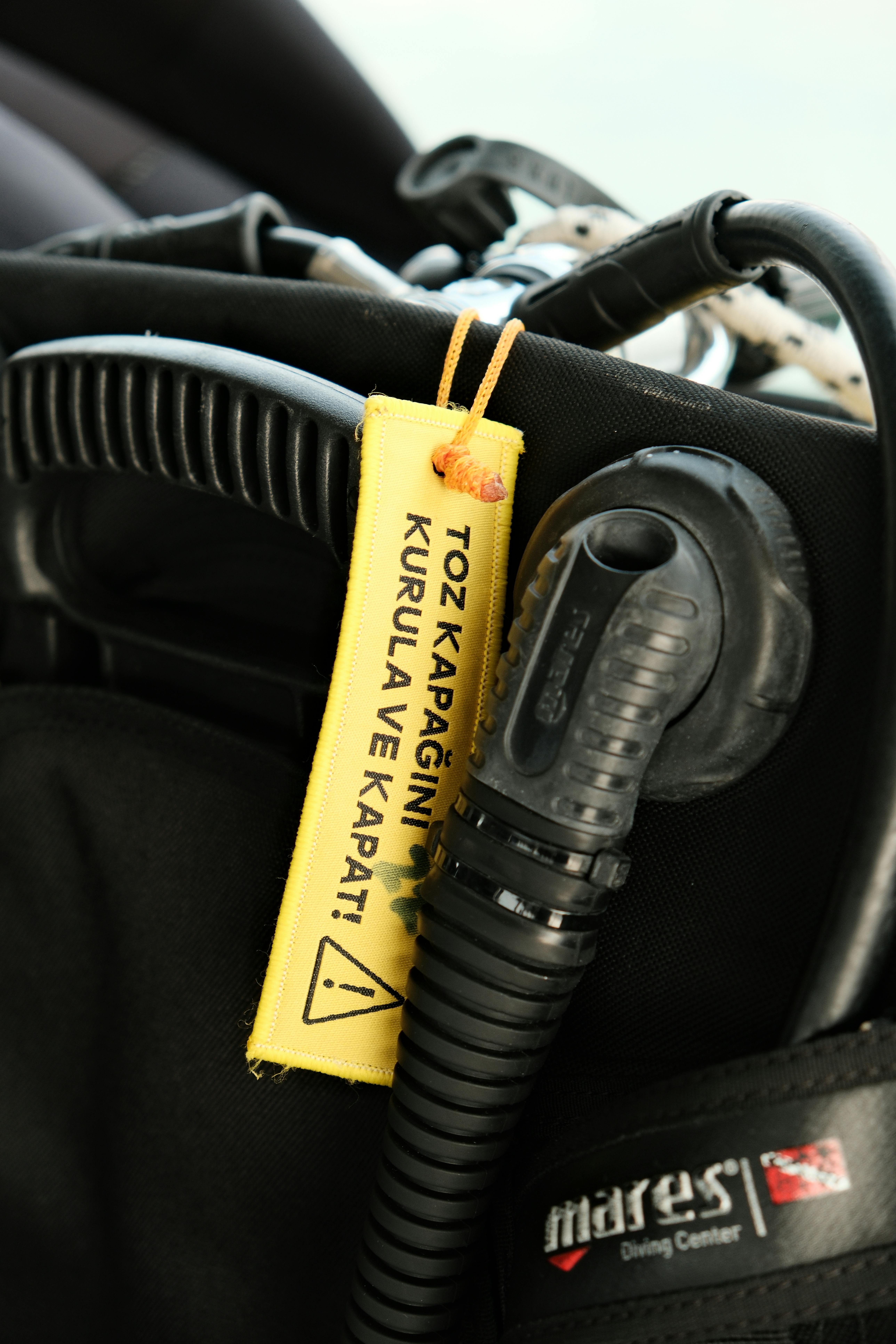 Close-Up of Diving Equipment with Safety Tag · Free Stock Photo