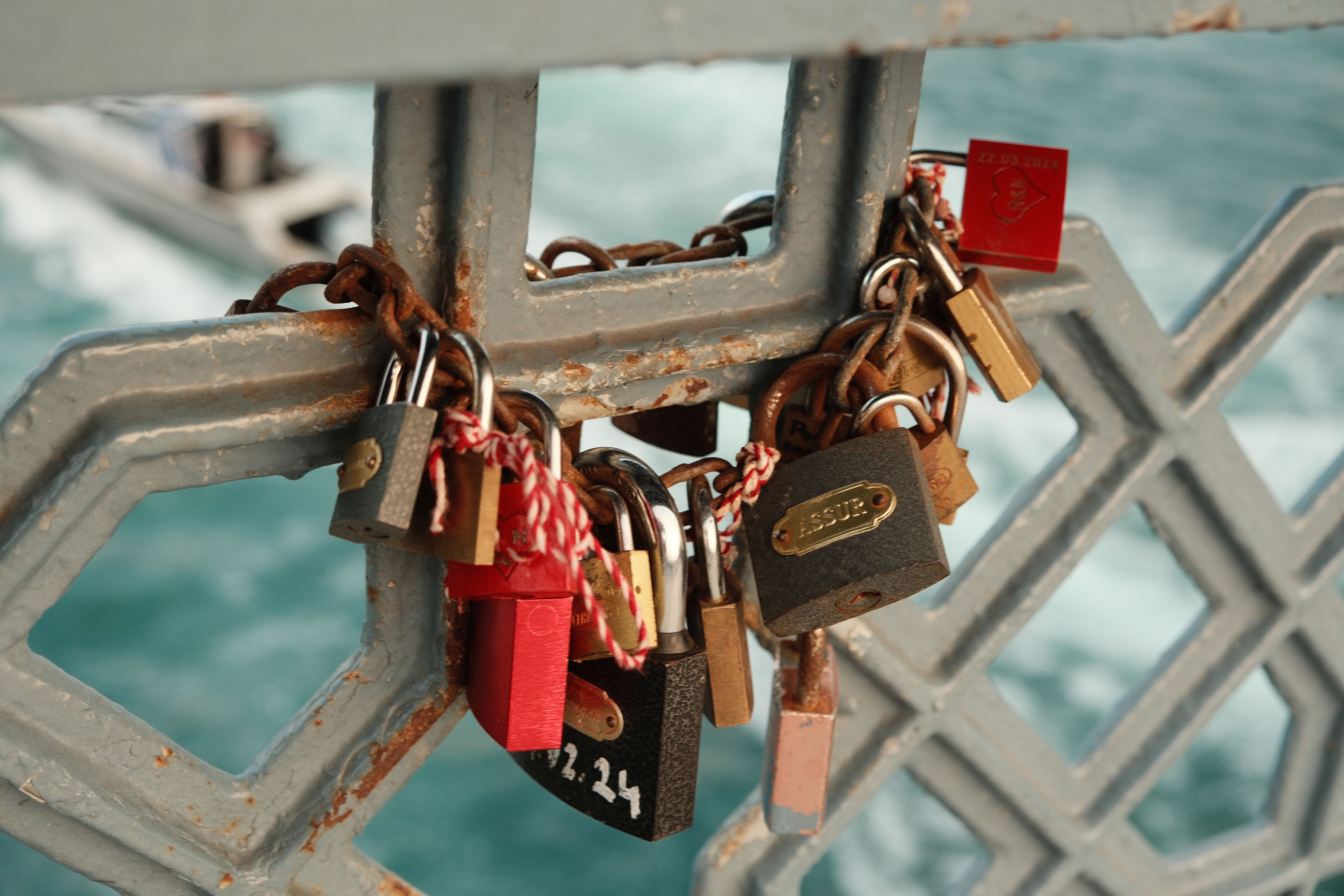 Symbolic Love Locks on a Bridge Railing · Free Stock Photo