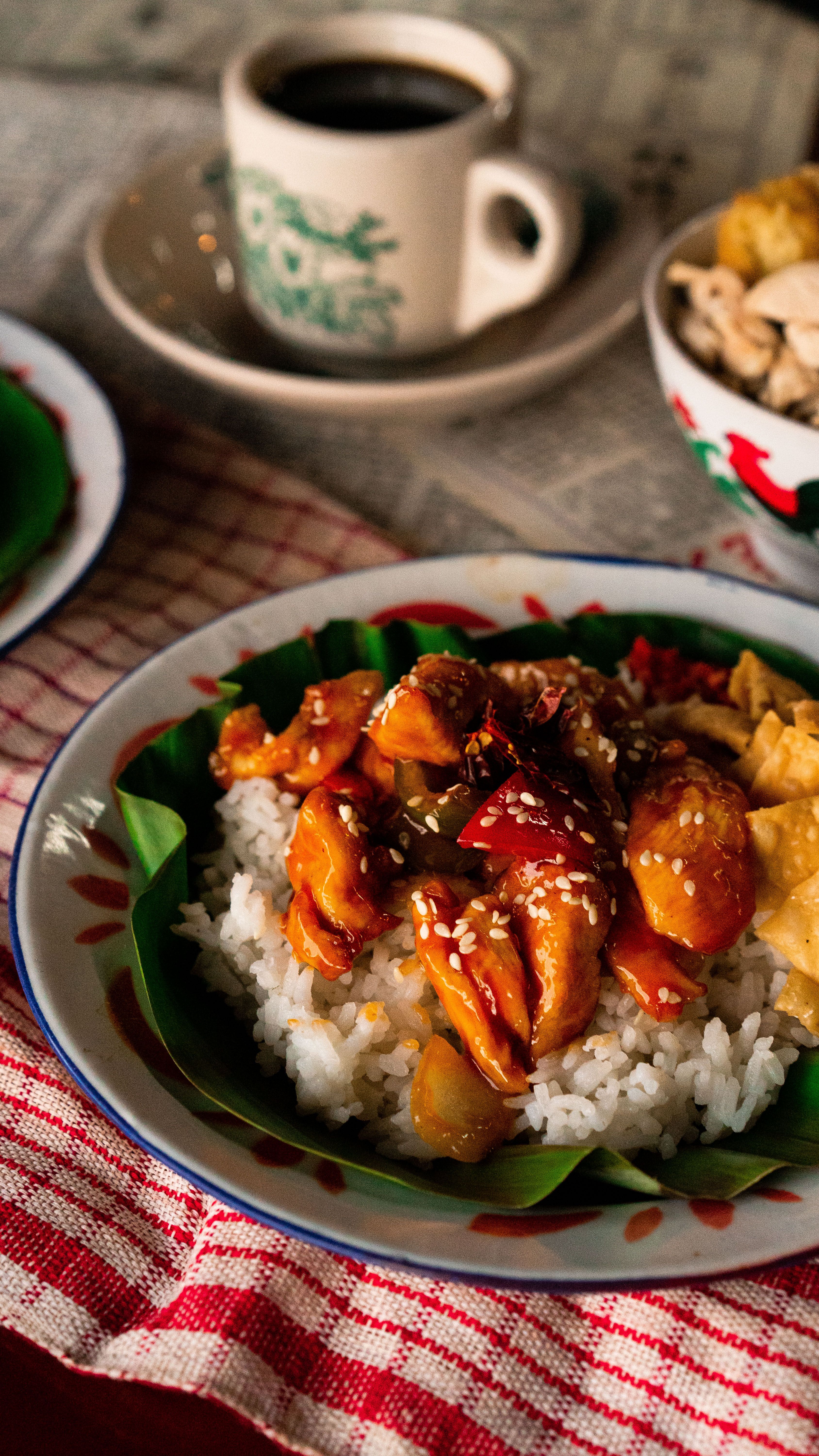 Chicken Kungpow with coffee on the cafe table · Free Stock Photo