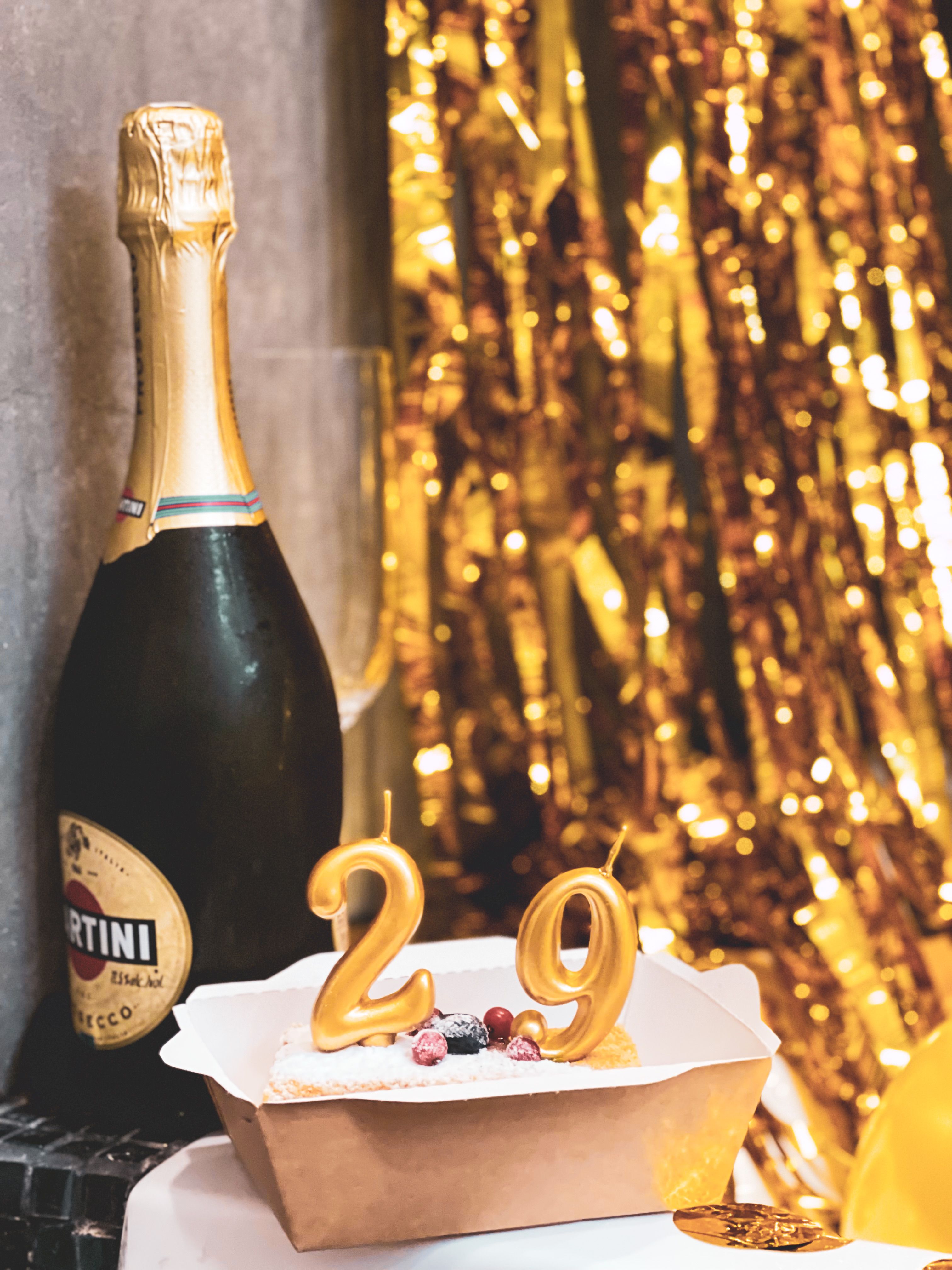 Celebrating 29th Birthday with Champagne and Cake · Free Stock Photo