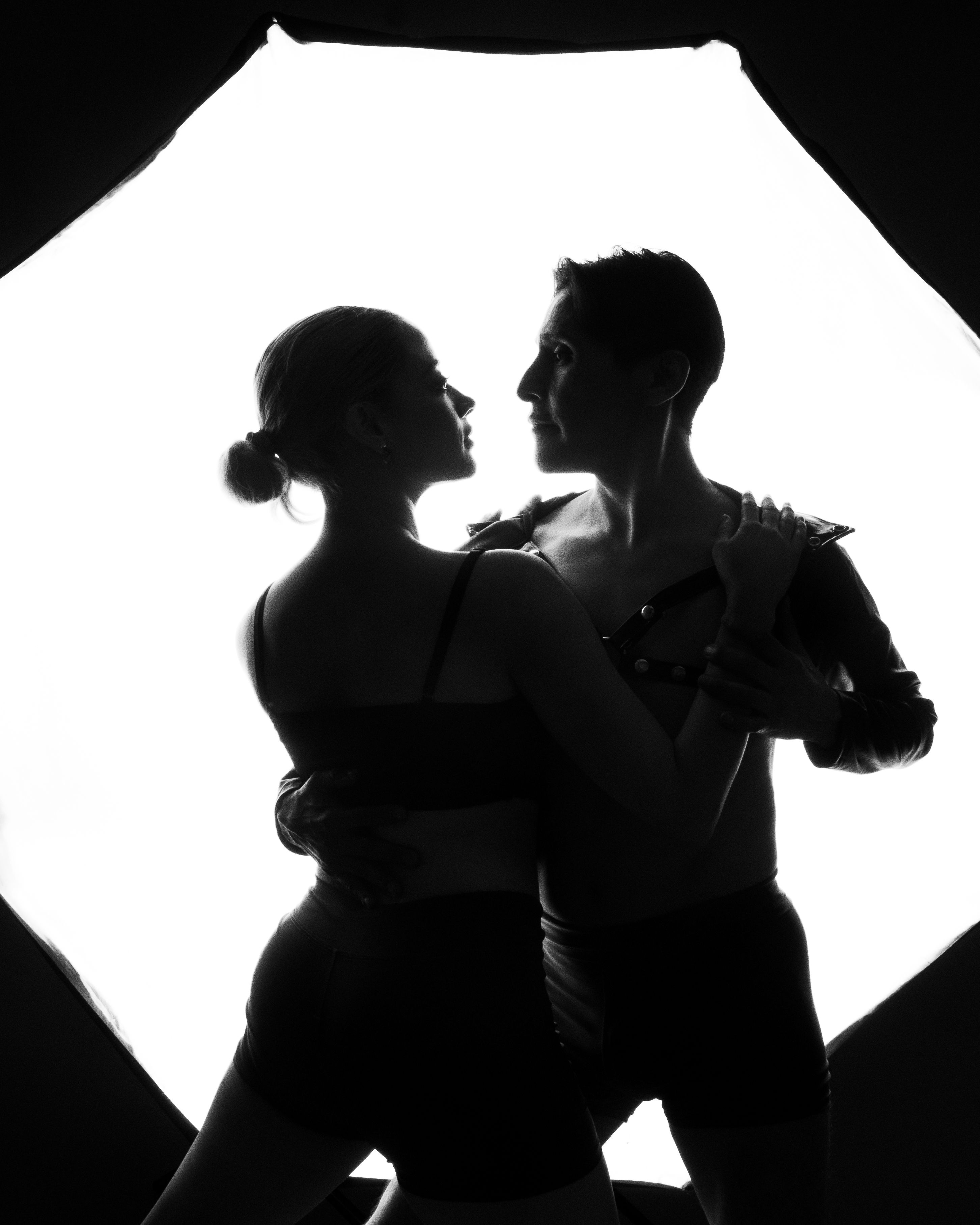 Silhouetted Couple in Artistic Dance Embrace · Free Stock Photo