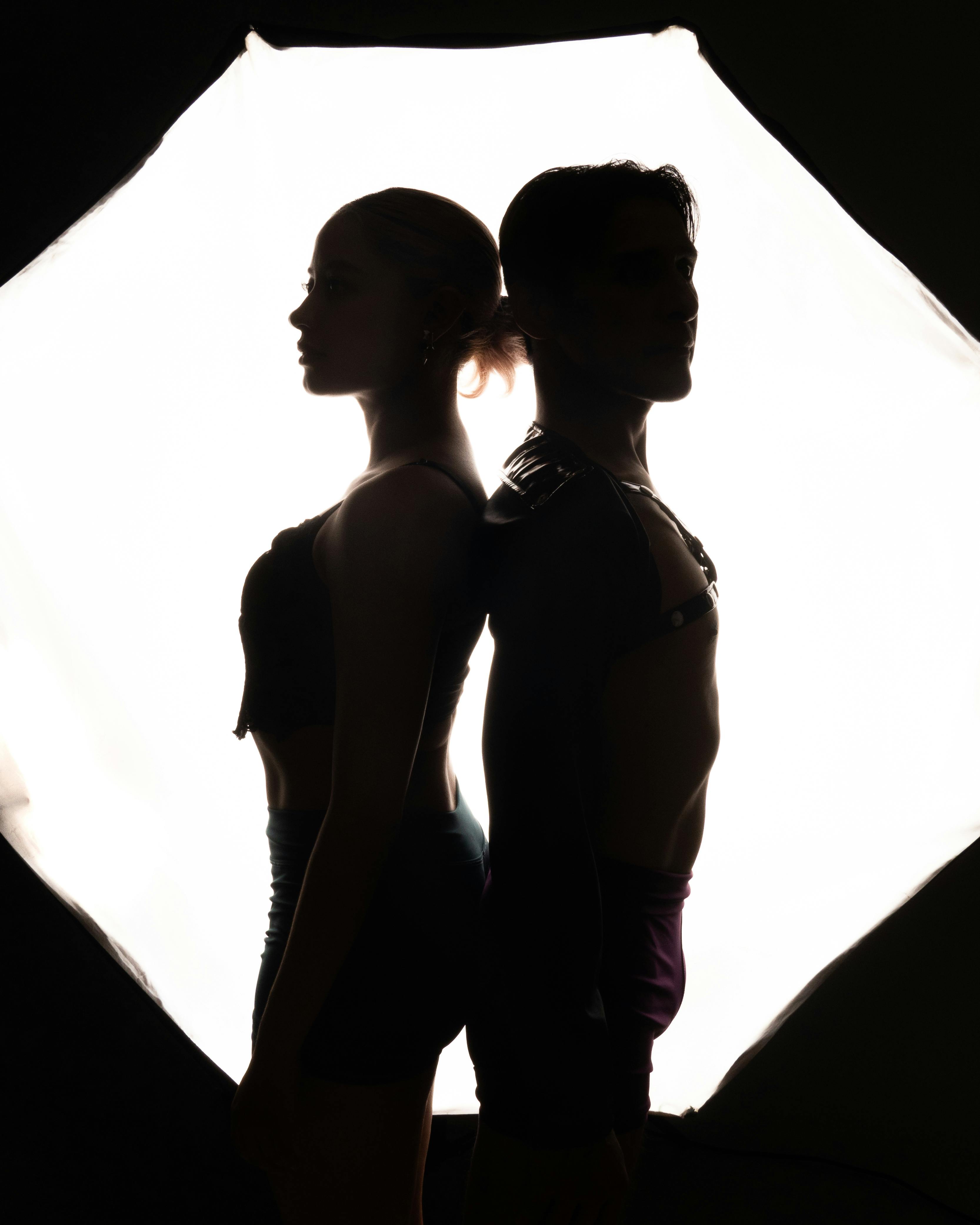 Silhouette of Dancers in Dramatic Backlight · Free Stock Photo