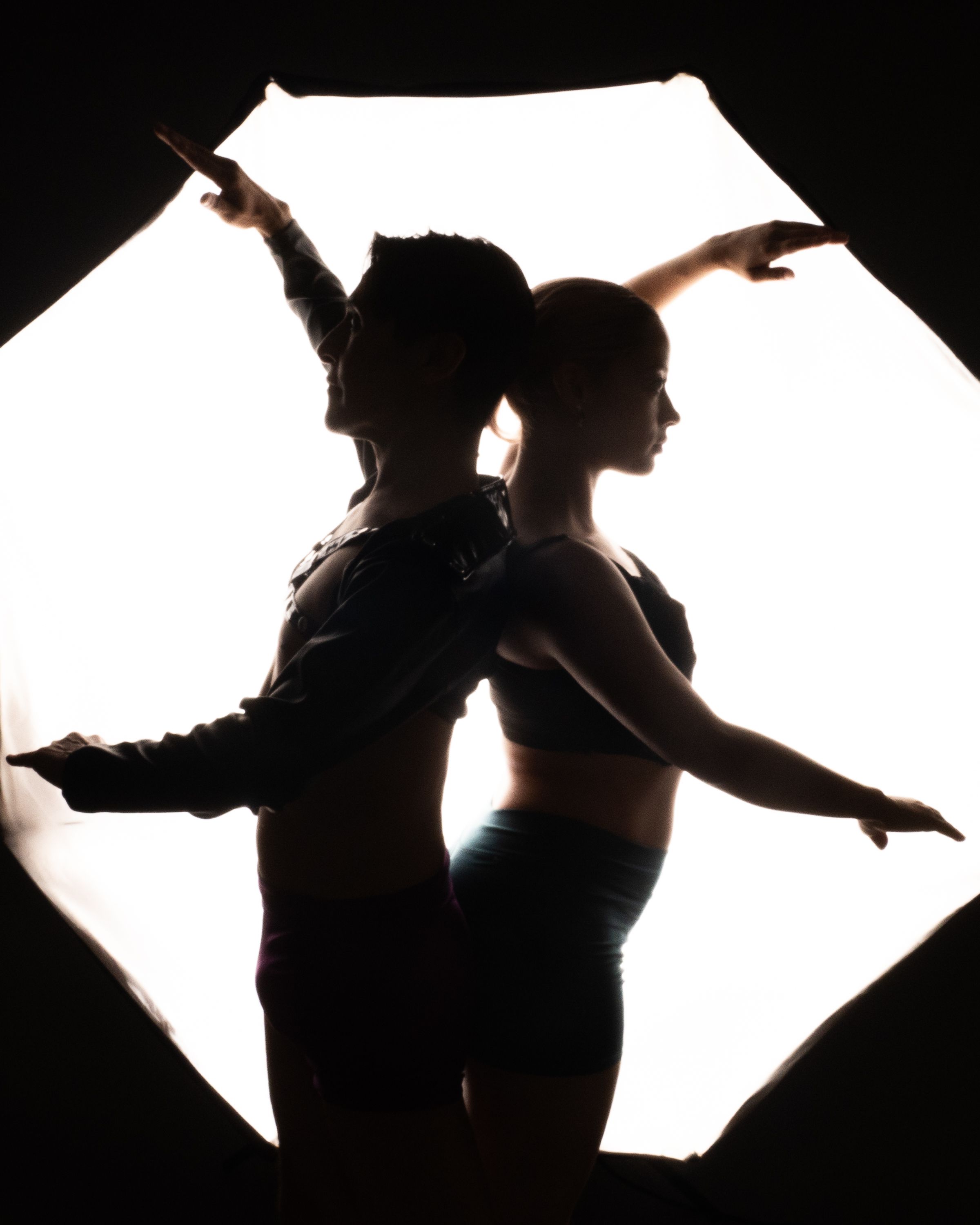 Silhouetted Contemporary Dancers Backlit in Studio · Free Stock Photo