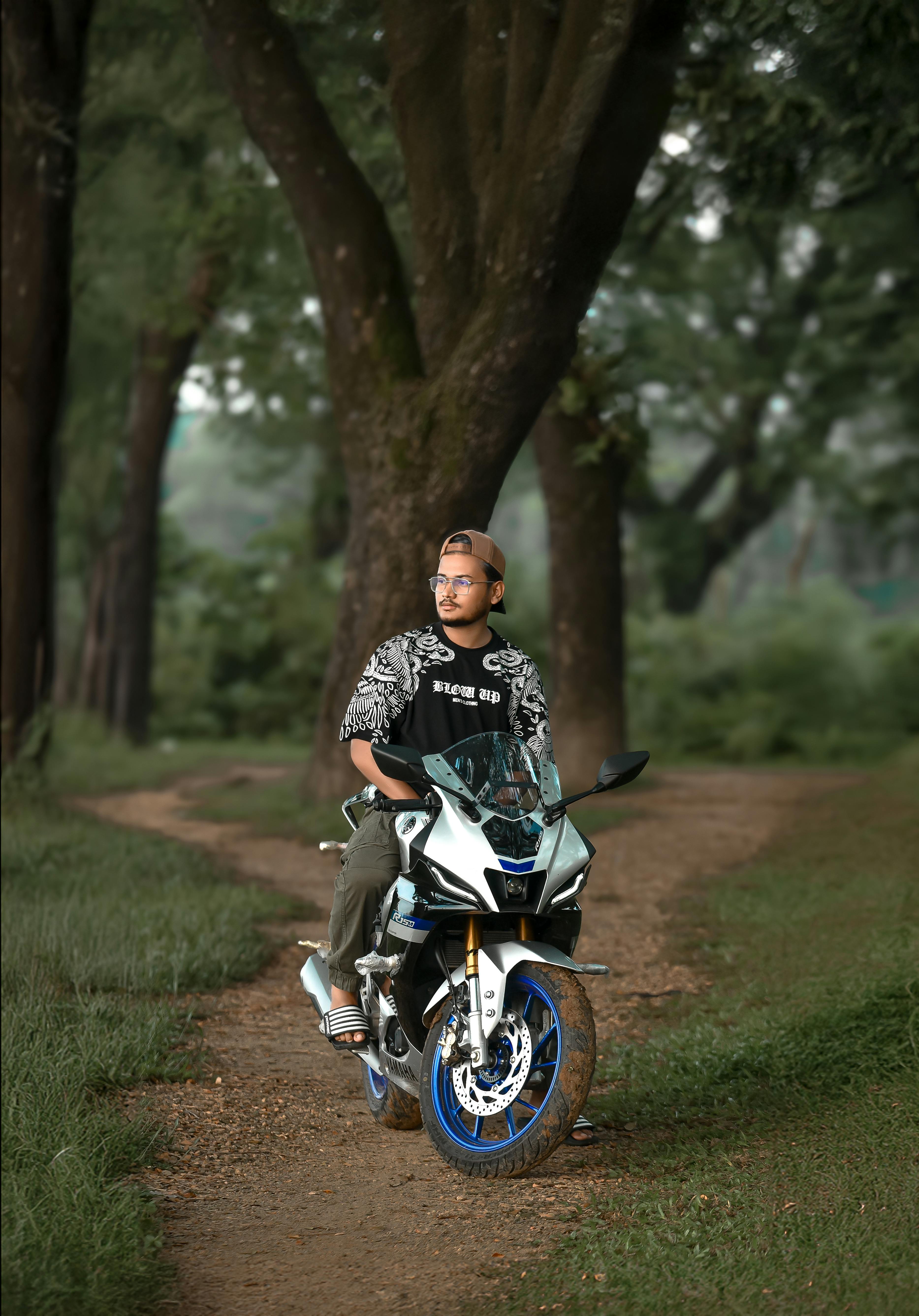 Man Riding Motorcycle on Forest Path · Free Stock Photo