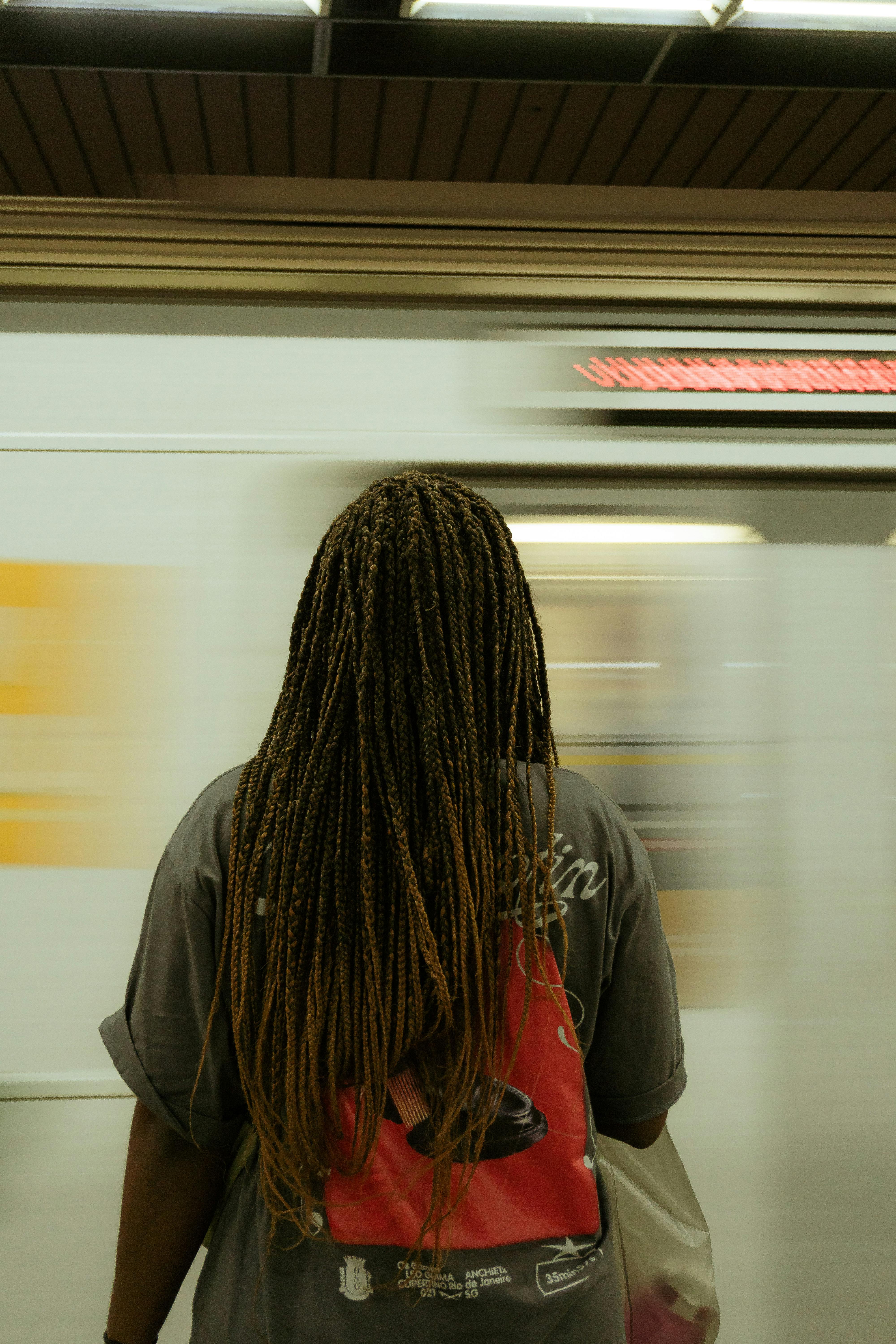 Woman with Braids in Rio de Janeiro Subway · Free Stock Photo
