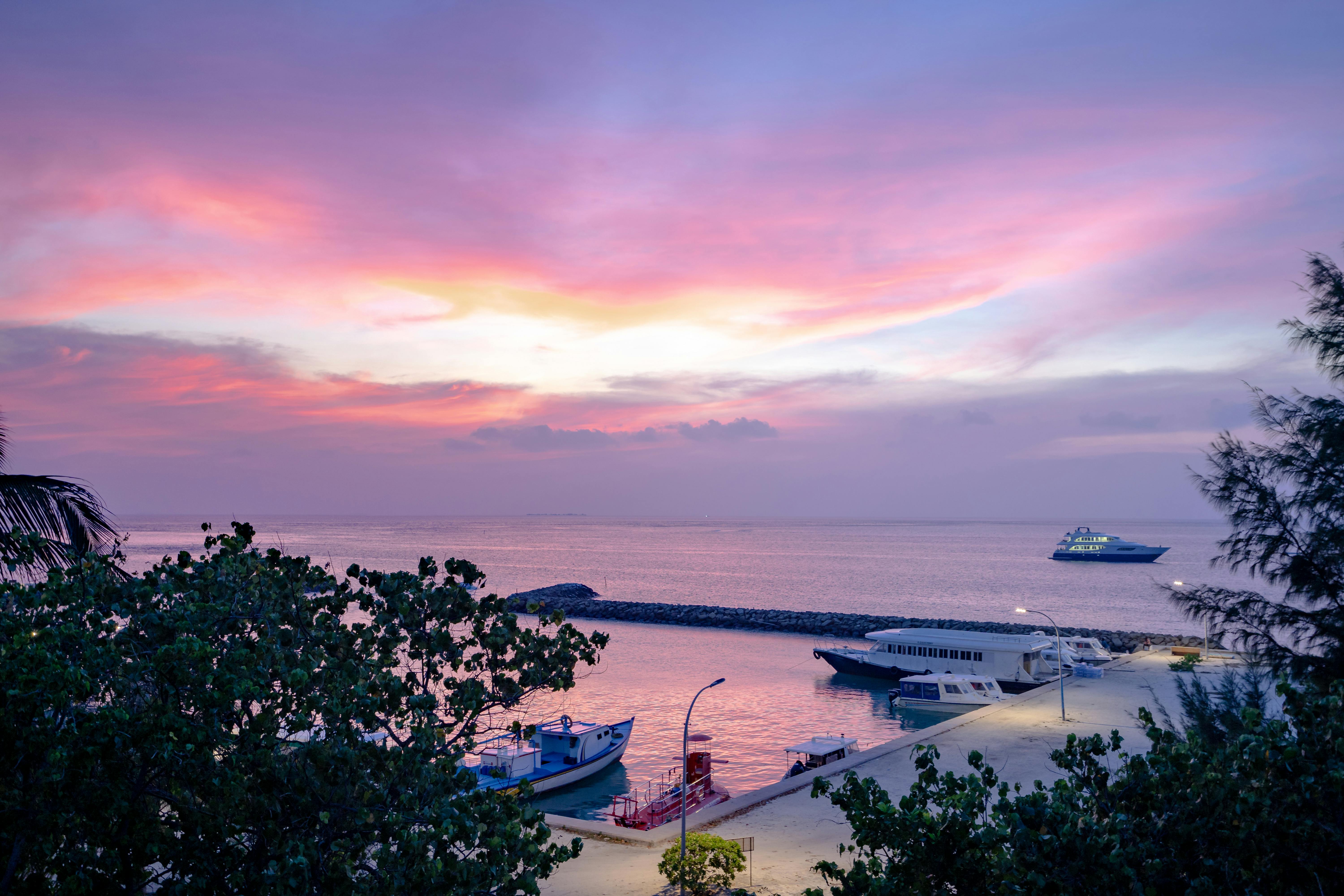 Sunset Over Turquoise Waters and Yachts · Free Stock Photo