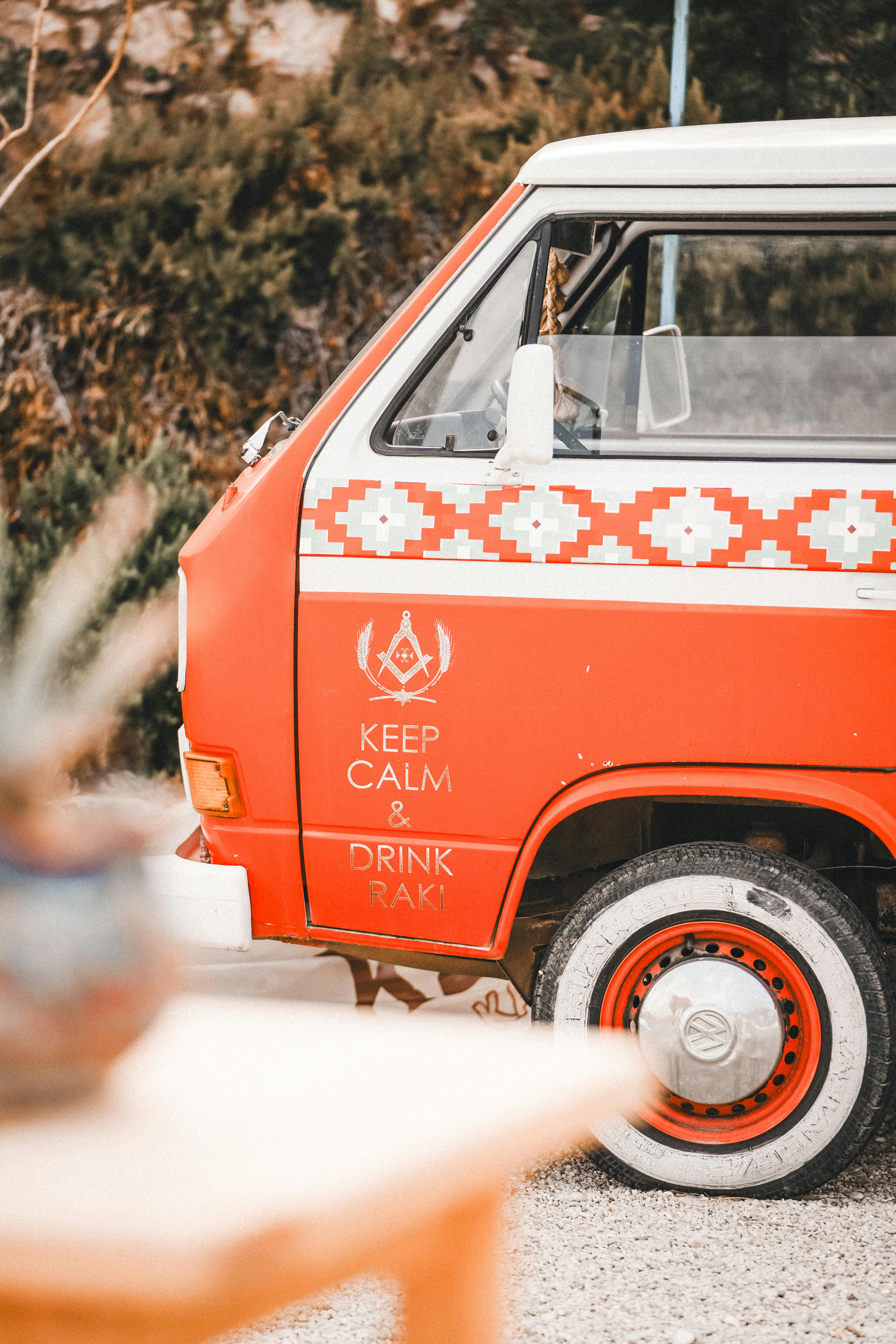Vintage Red Van with Bohemian Patterns Outdoors · Free Stock Photo